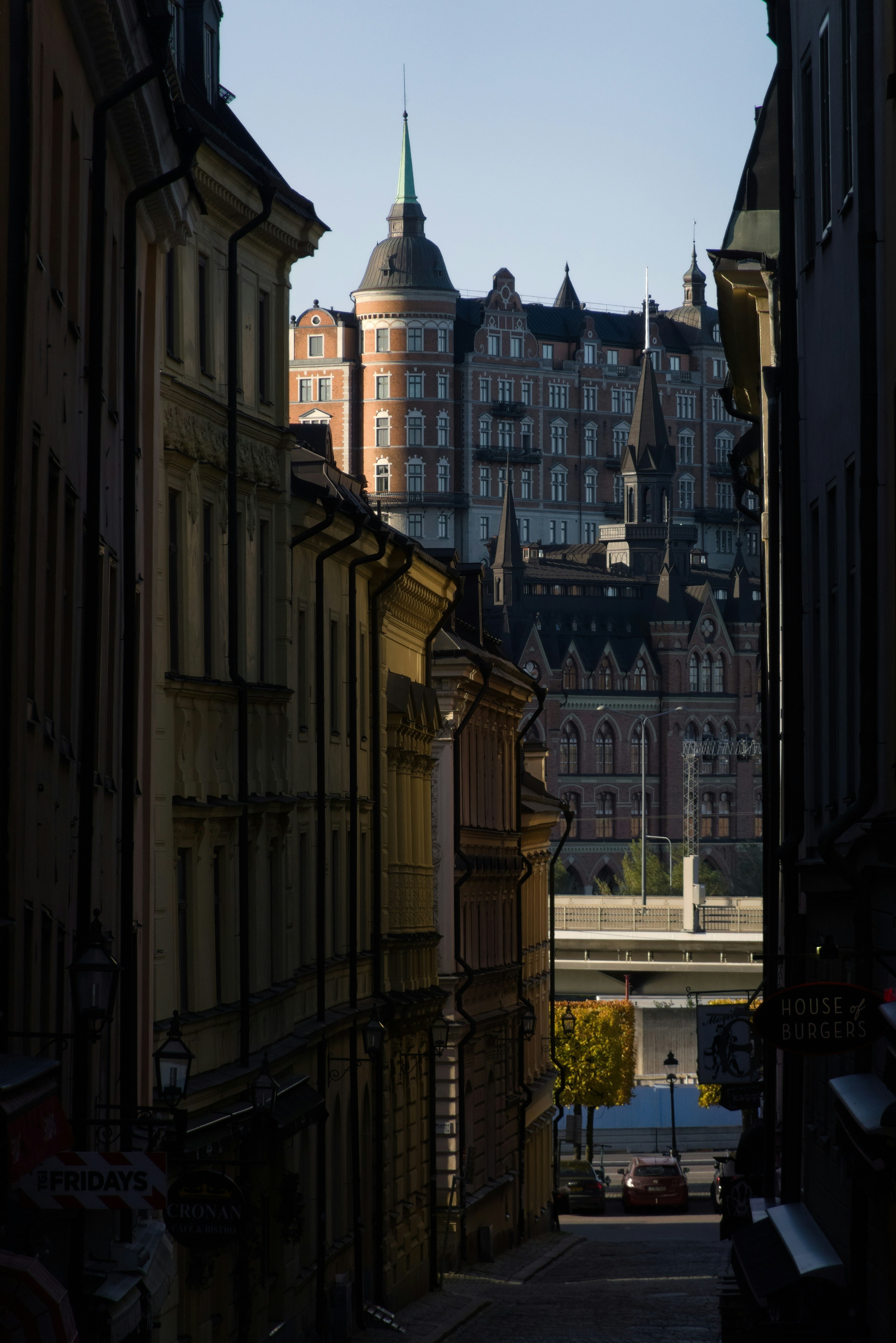 Toward the Turreted Citadel: A Narrow Street Framing a Grand Skyline