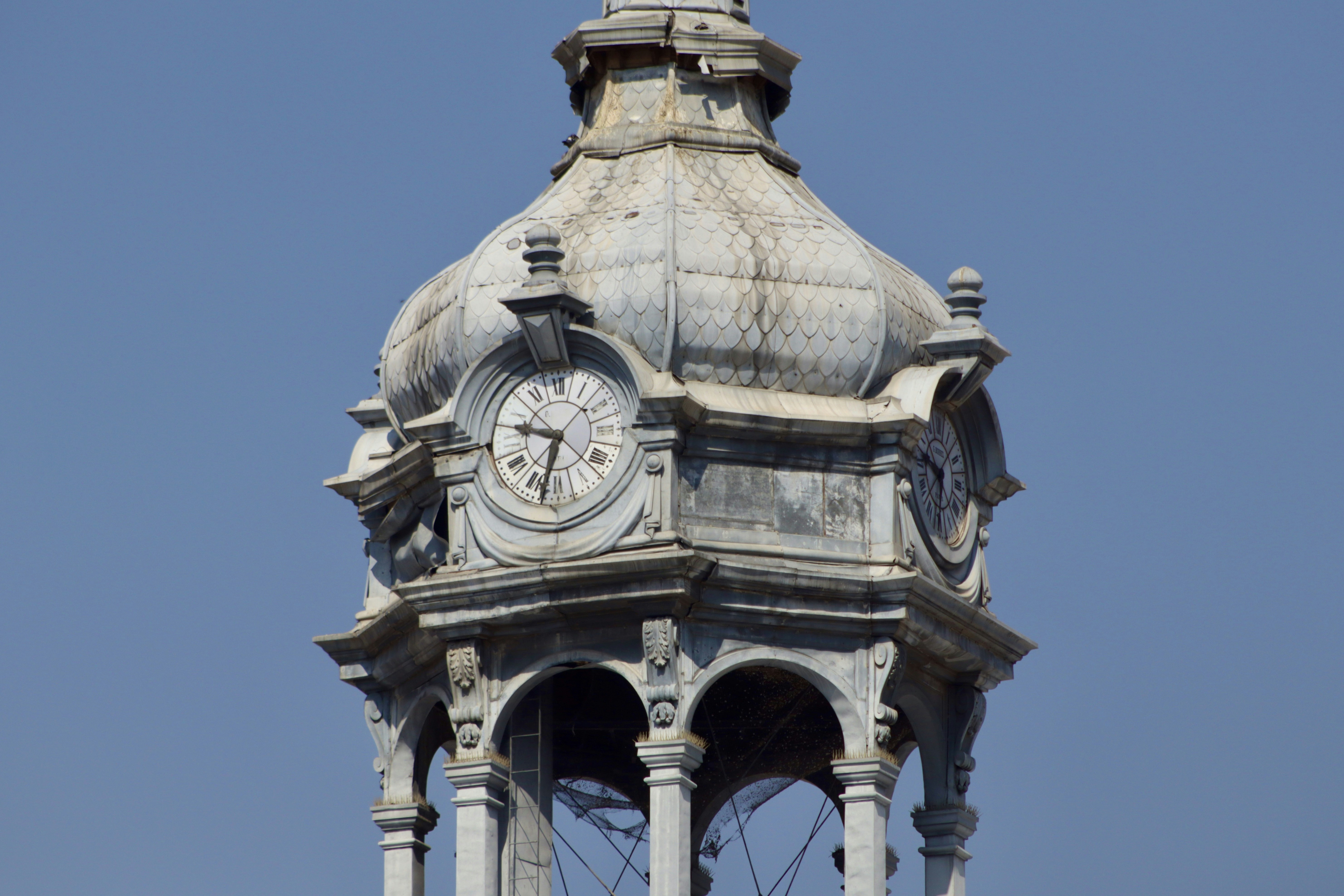 Timeless Bell Tower: Stone Dôme Against a Clear Sky