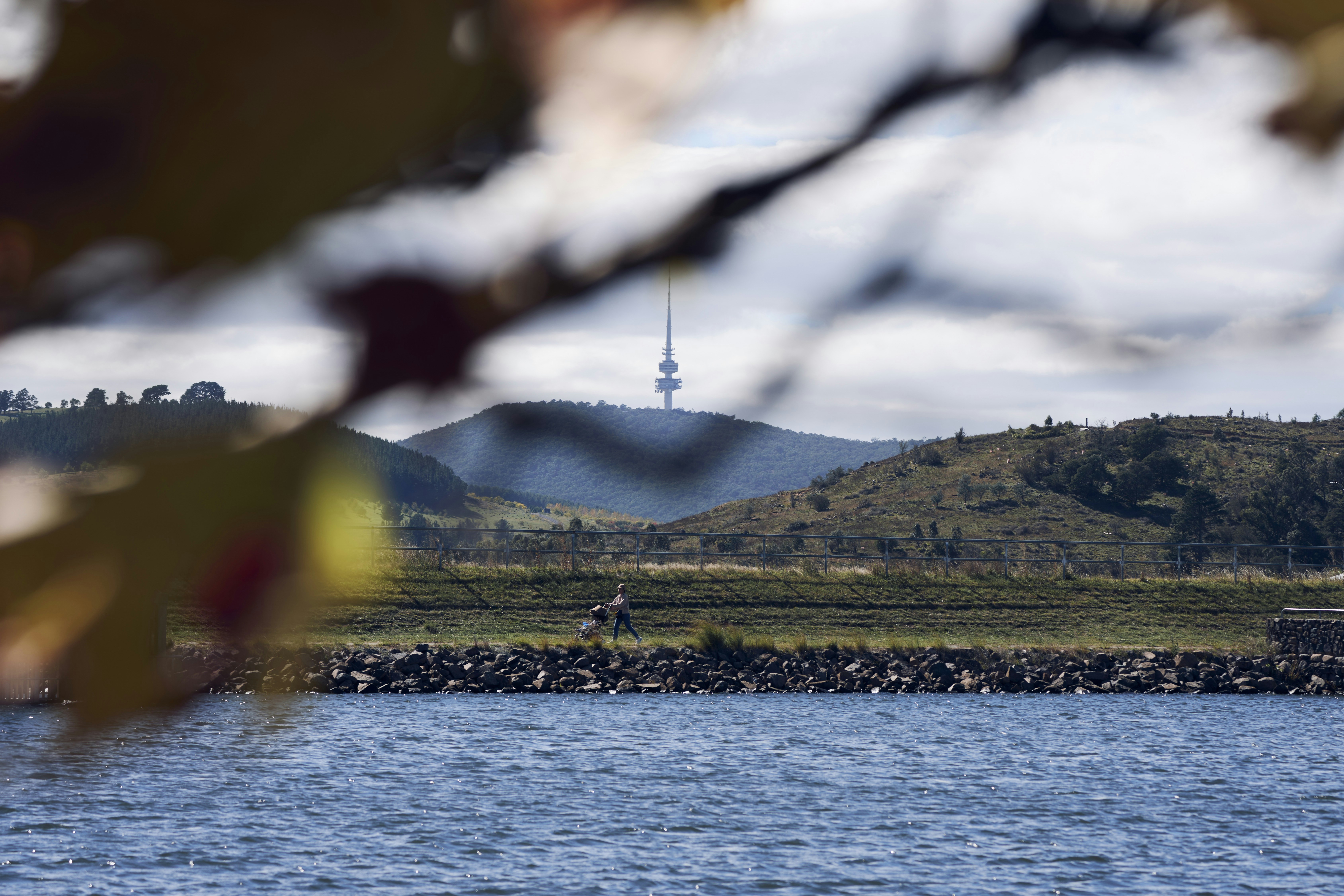 Lone Angler by the Dam: A Quiet Horizon