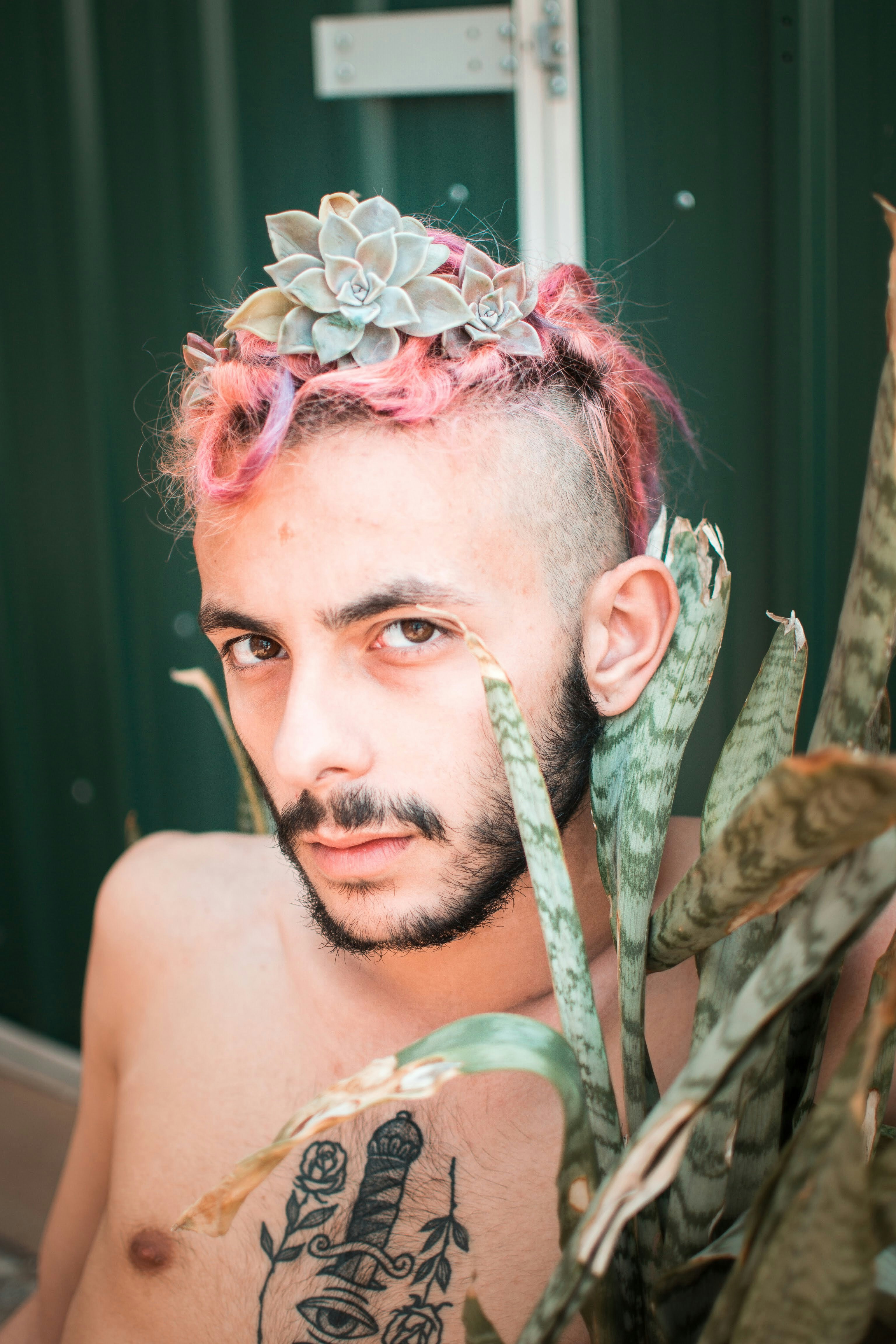 Succulent Crowned Portrait: A Surreal Moment with Pink-Tinted Hair