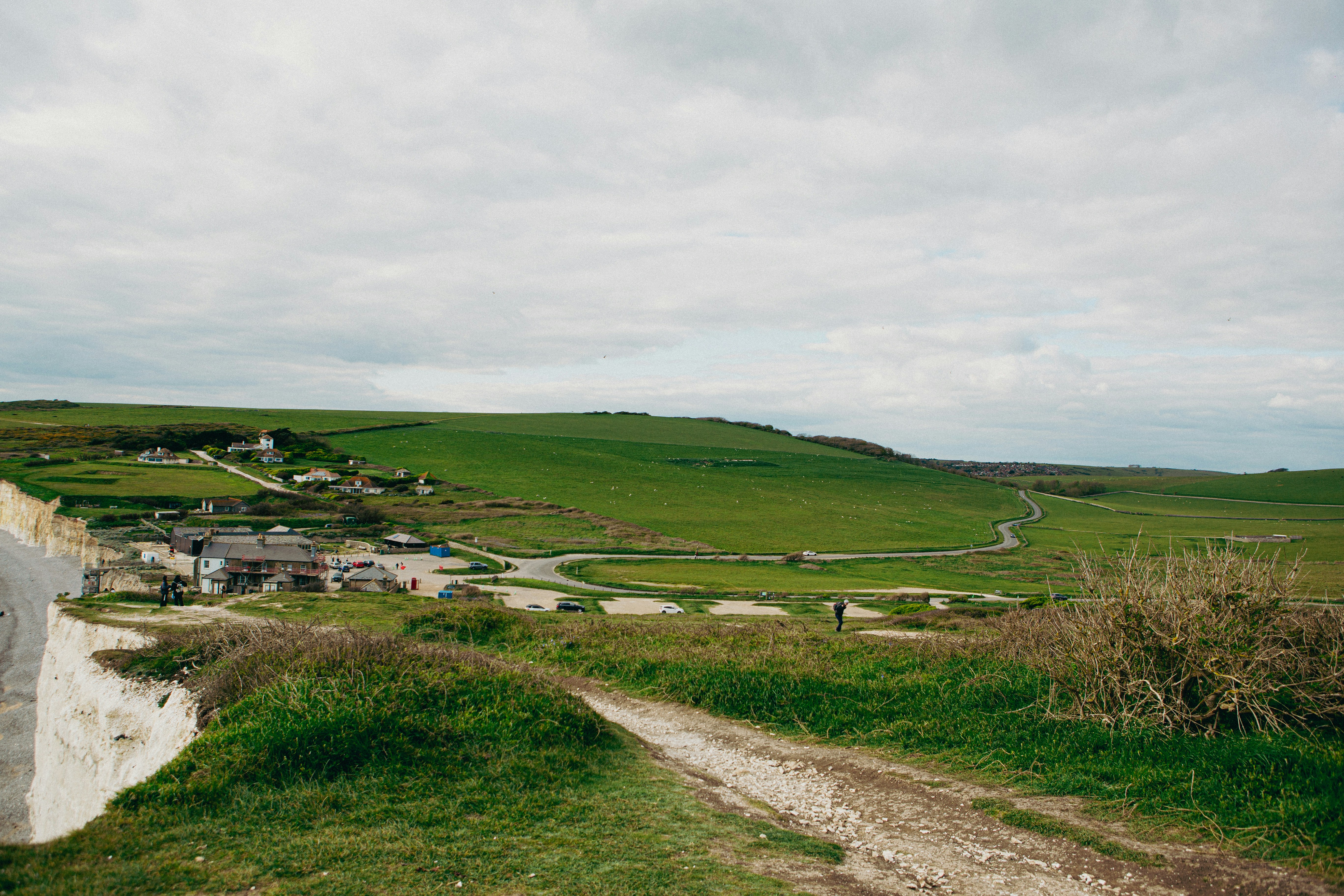Chalk Cliff Overlook into a Green Valley Hamlet