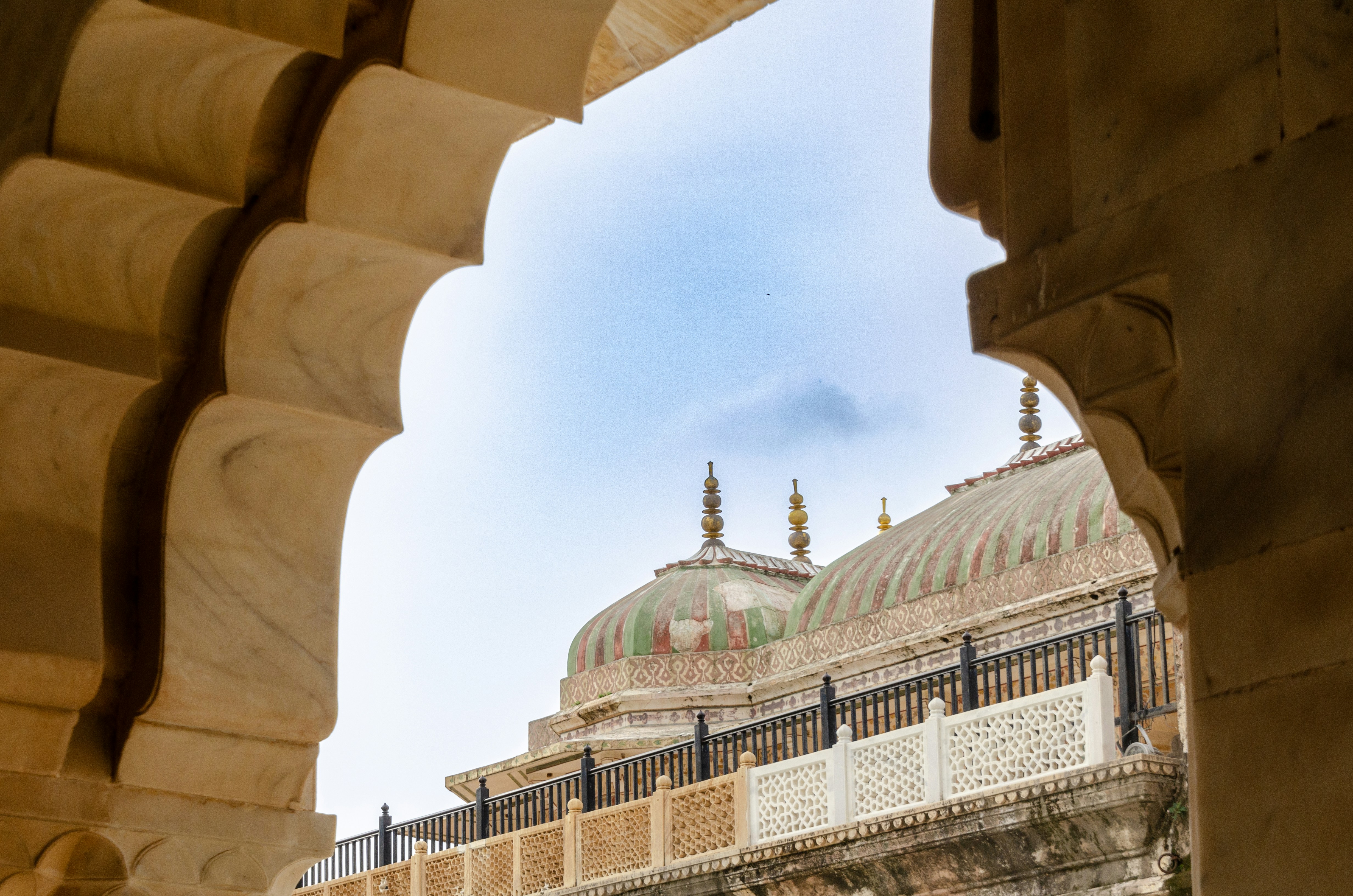 A view of a building through an arch photo – Free Amer fort Image on ...