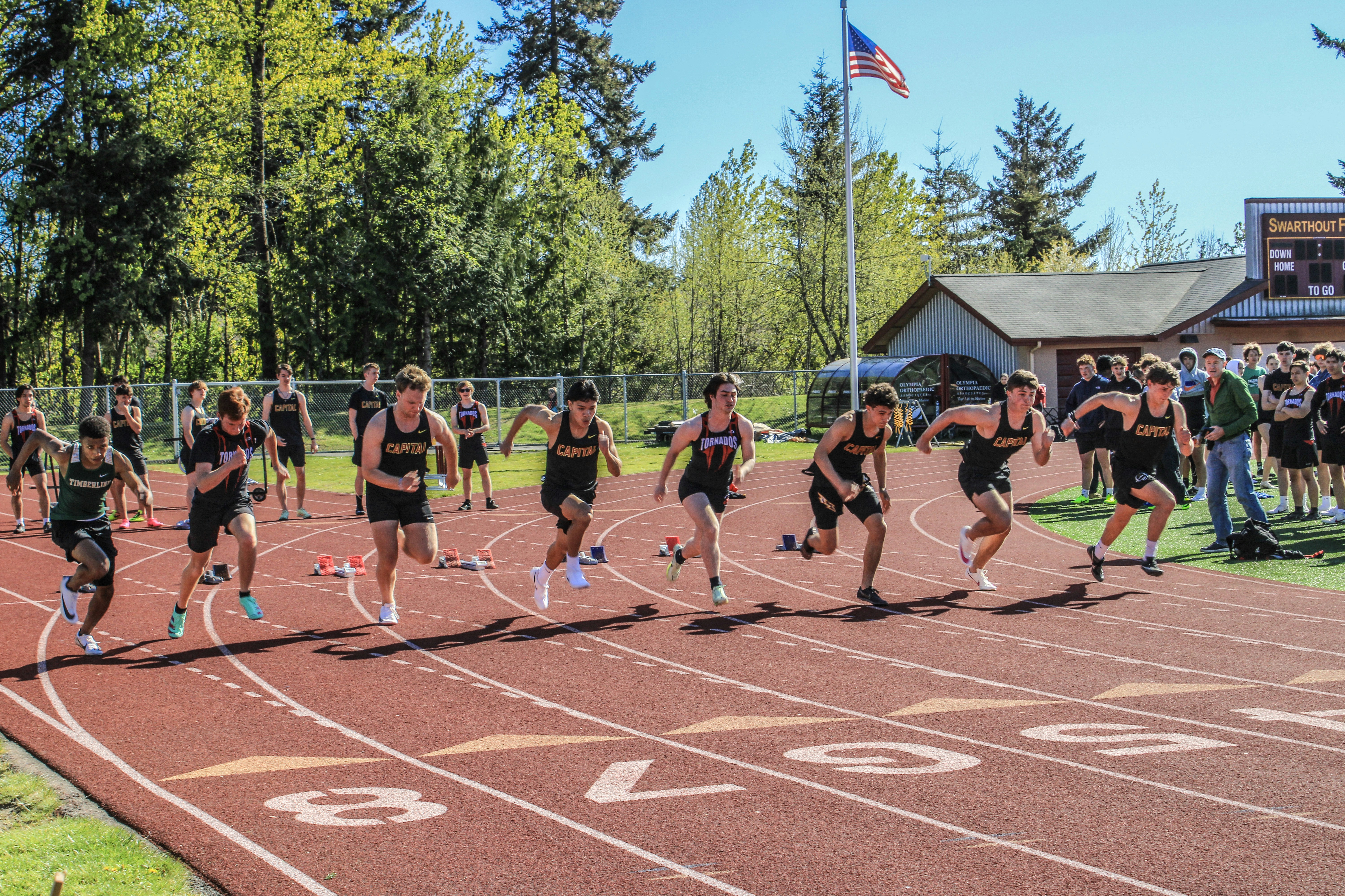 A group of people running on a track photo – Free Olympia Image on Unsplash