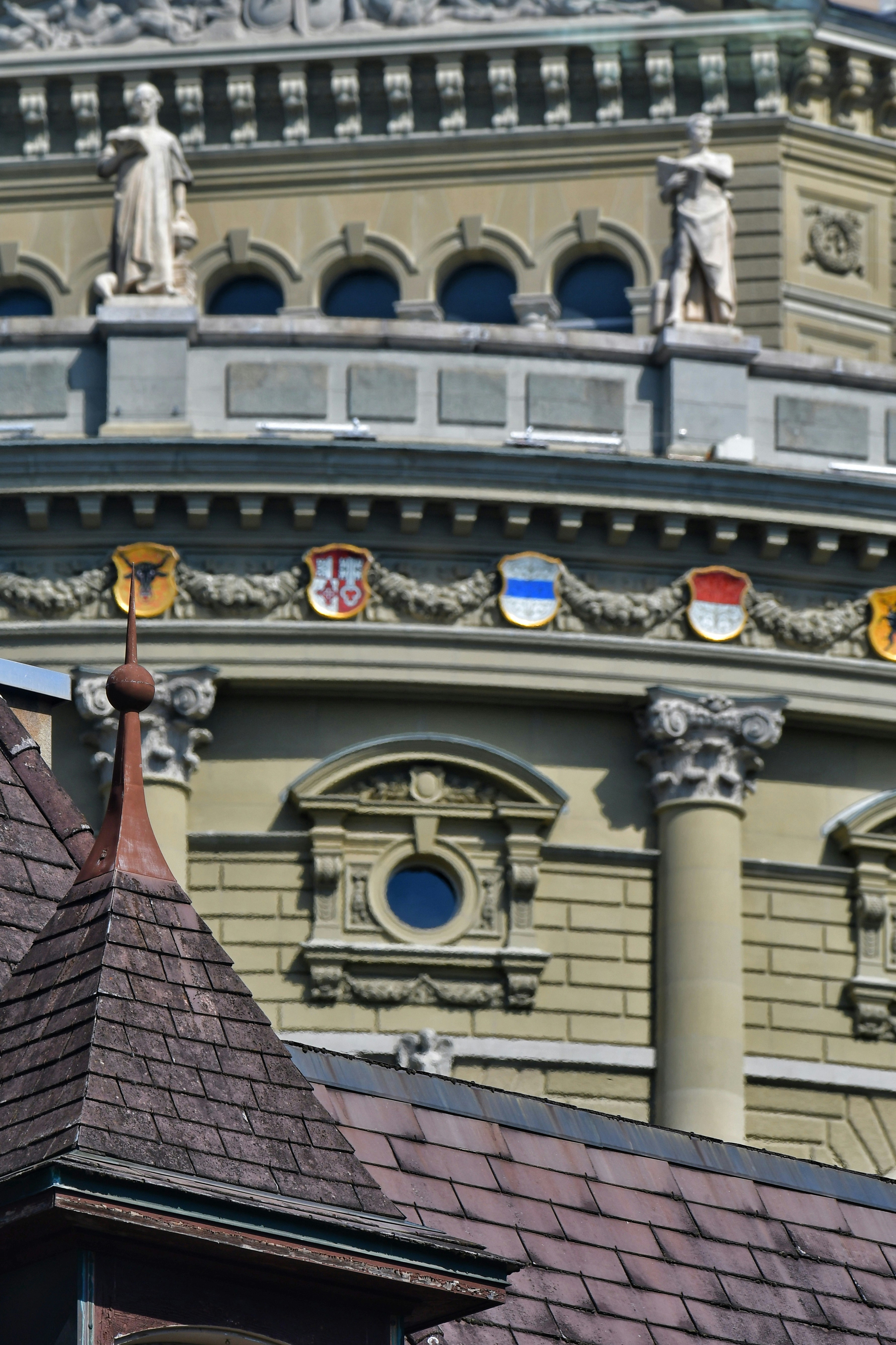 A building with a clock on the front of it photo – Free Woman Image on ...