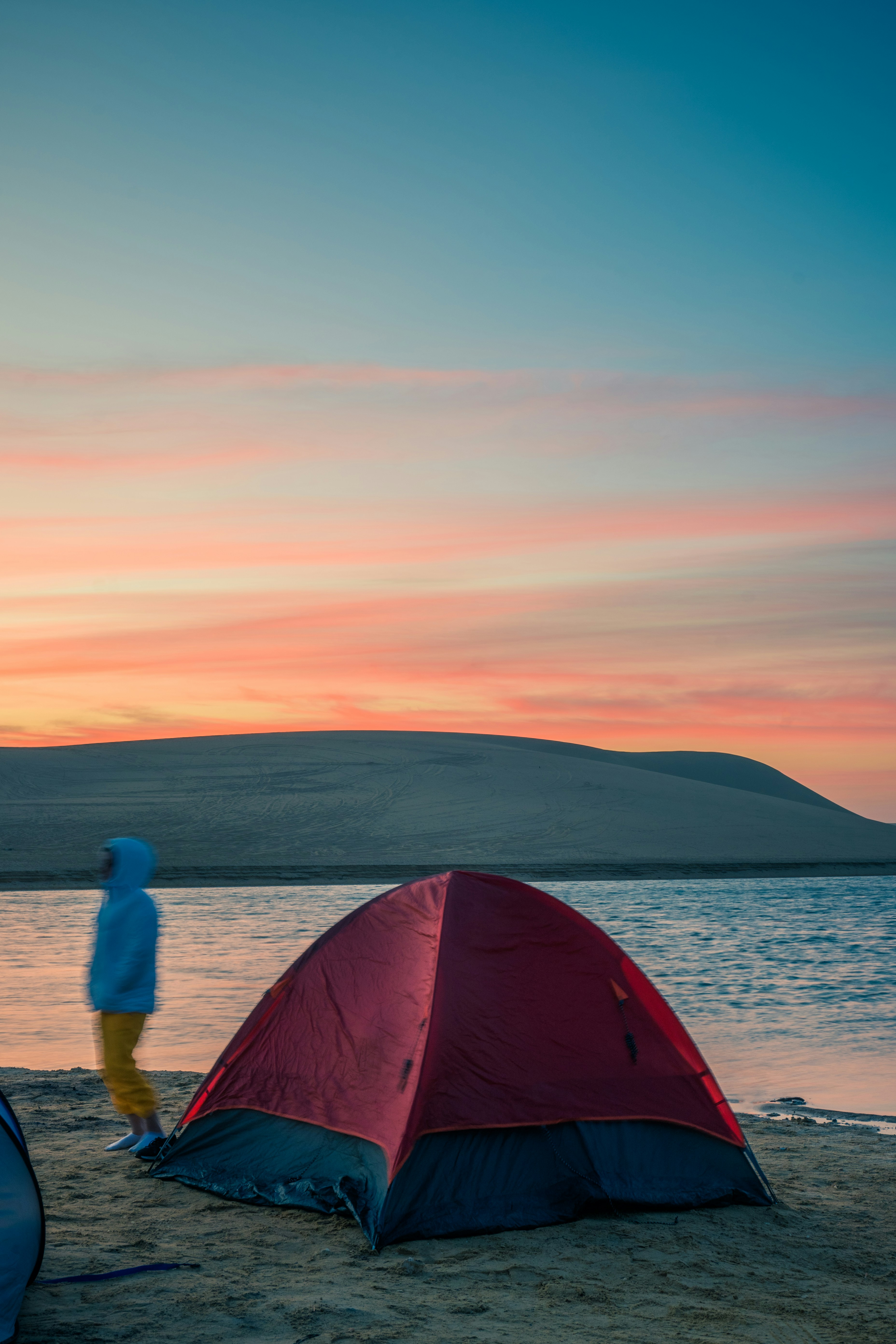 Crimson Dome at Dusk: A Quiet Beach Camp Beneath a Pastel Horizon
