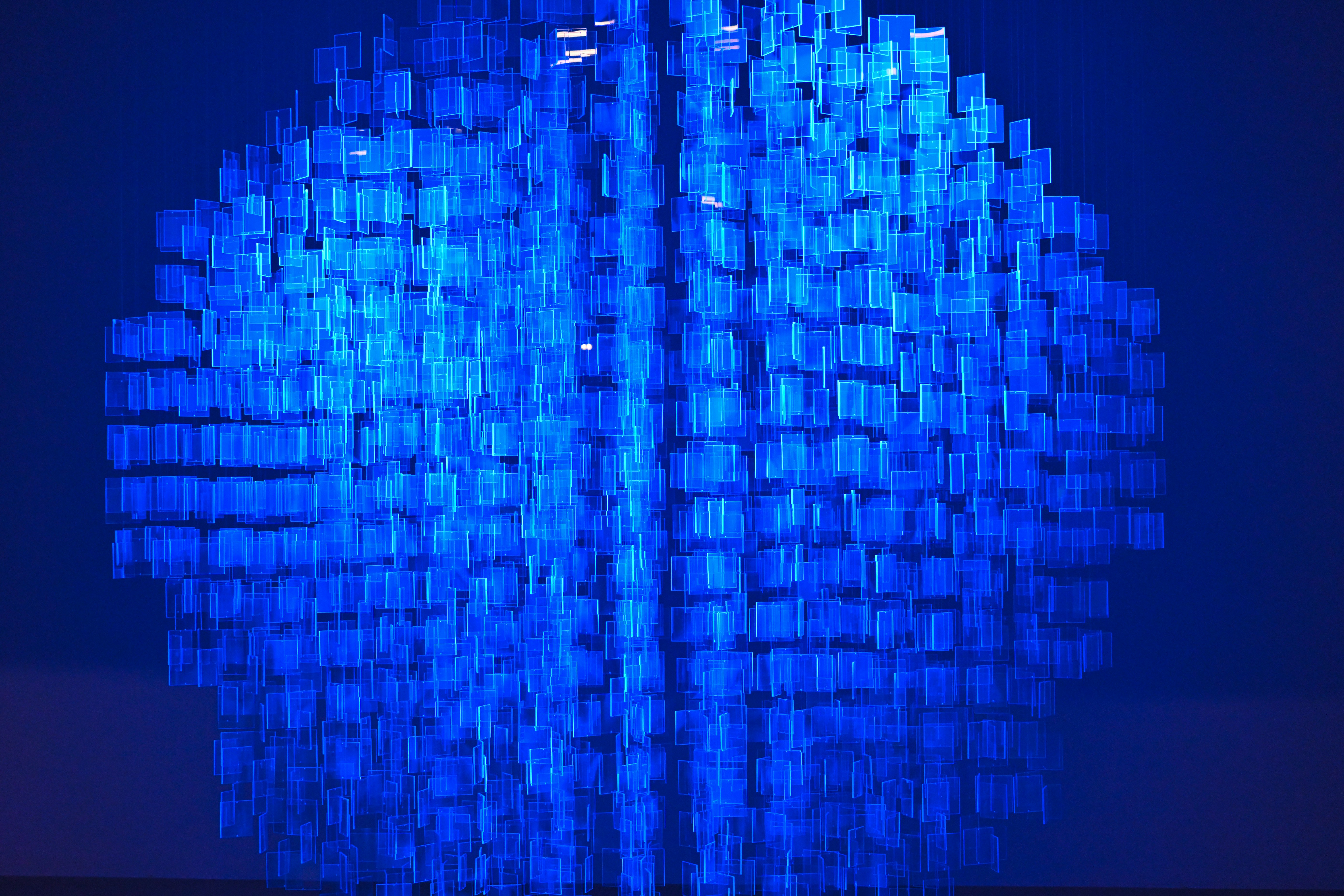 A very tall building made of blue glass blocks photo – Free Blue Image ...