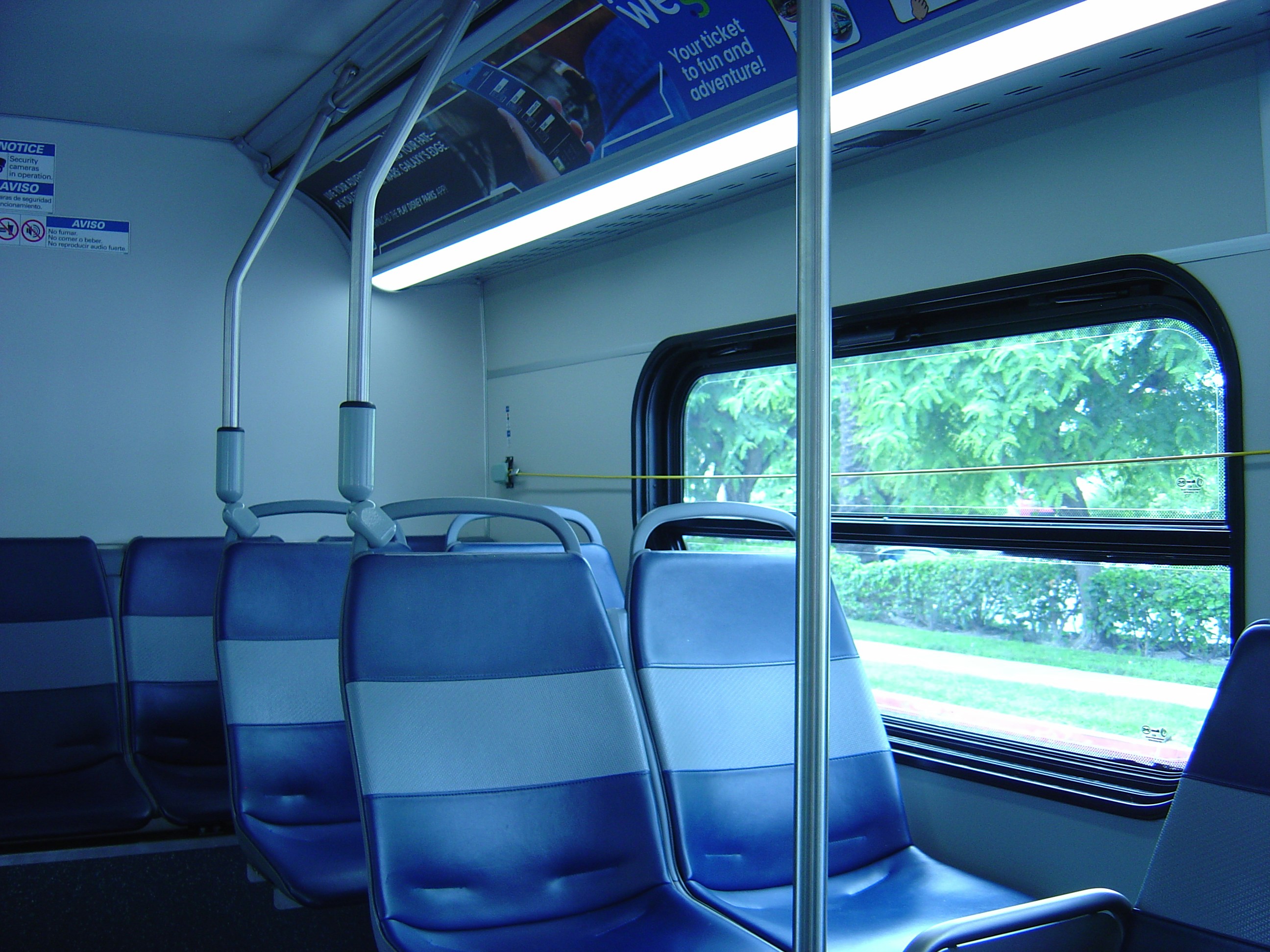 Midday Blues in Transit: Empty Bus Cabin with Striped Seats