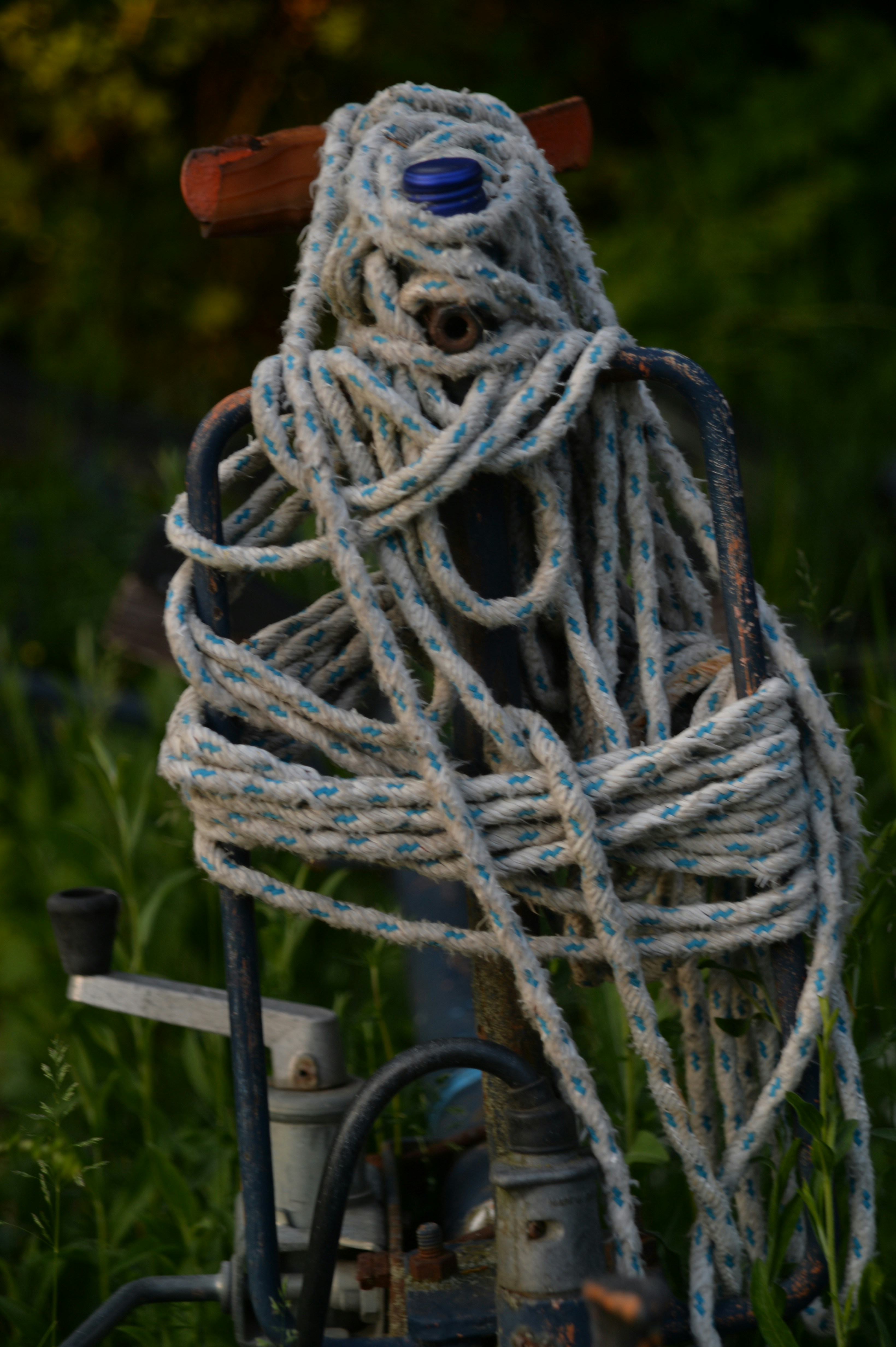 Tangled Rope on Weathered Machinery: A Textural Close-Up