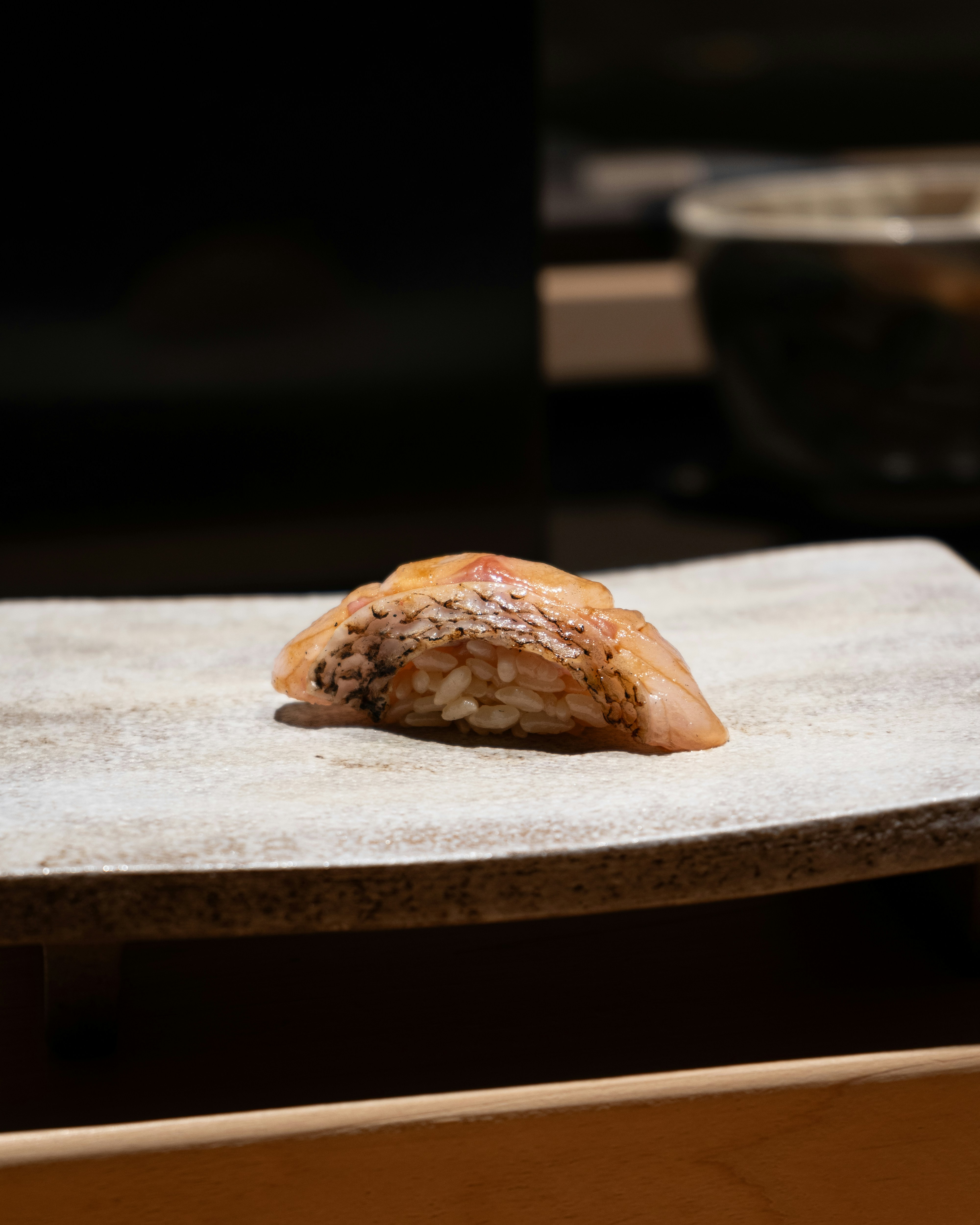 A piece of sushi sitting on top of a table photo – Free Food Image on ...