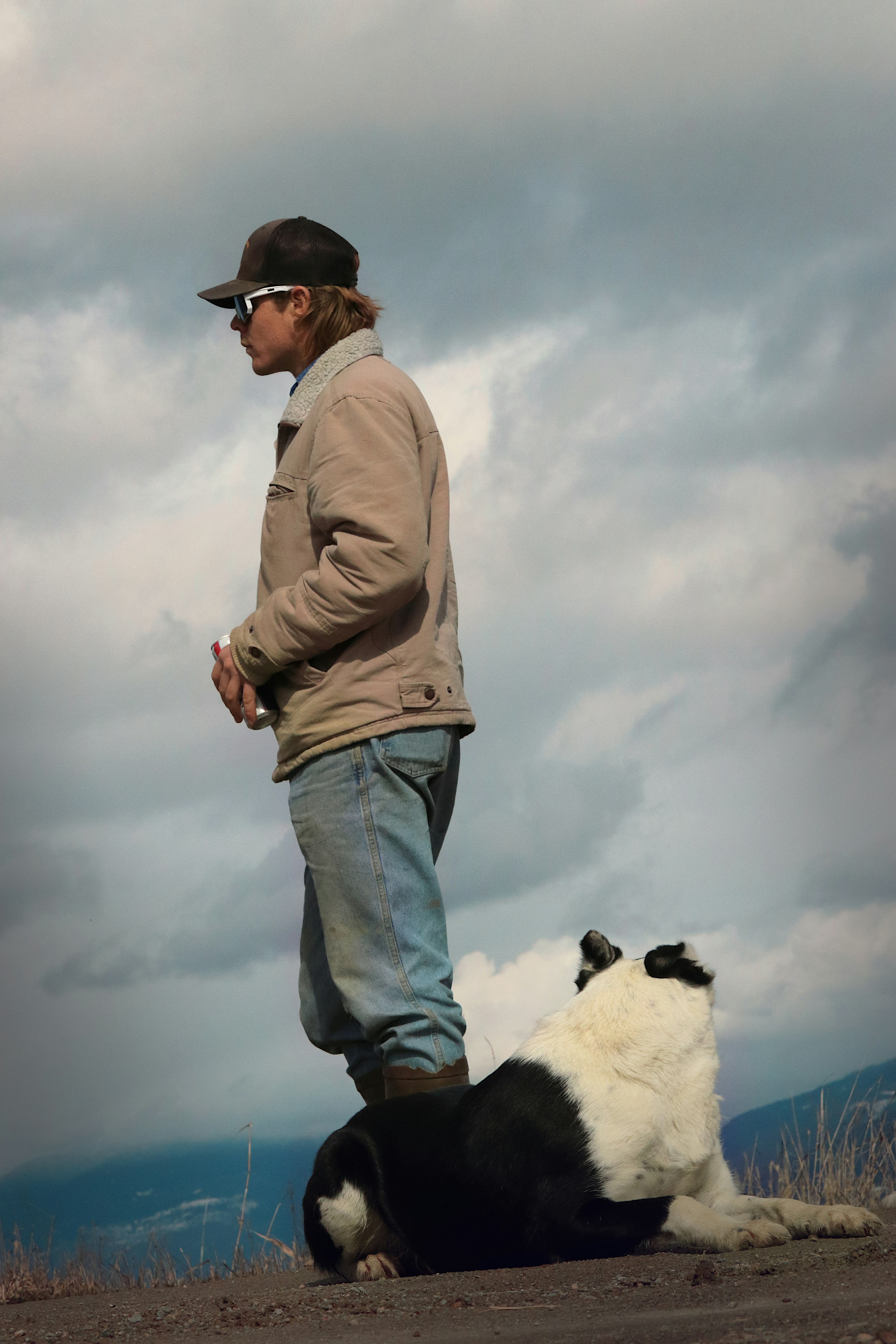 Standground and Shadow: A Man and His Border Collie in Horizon Light