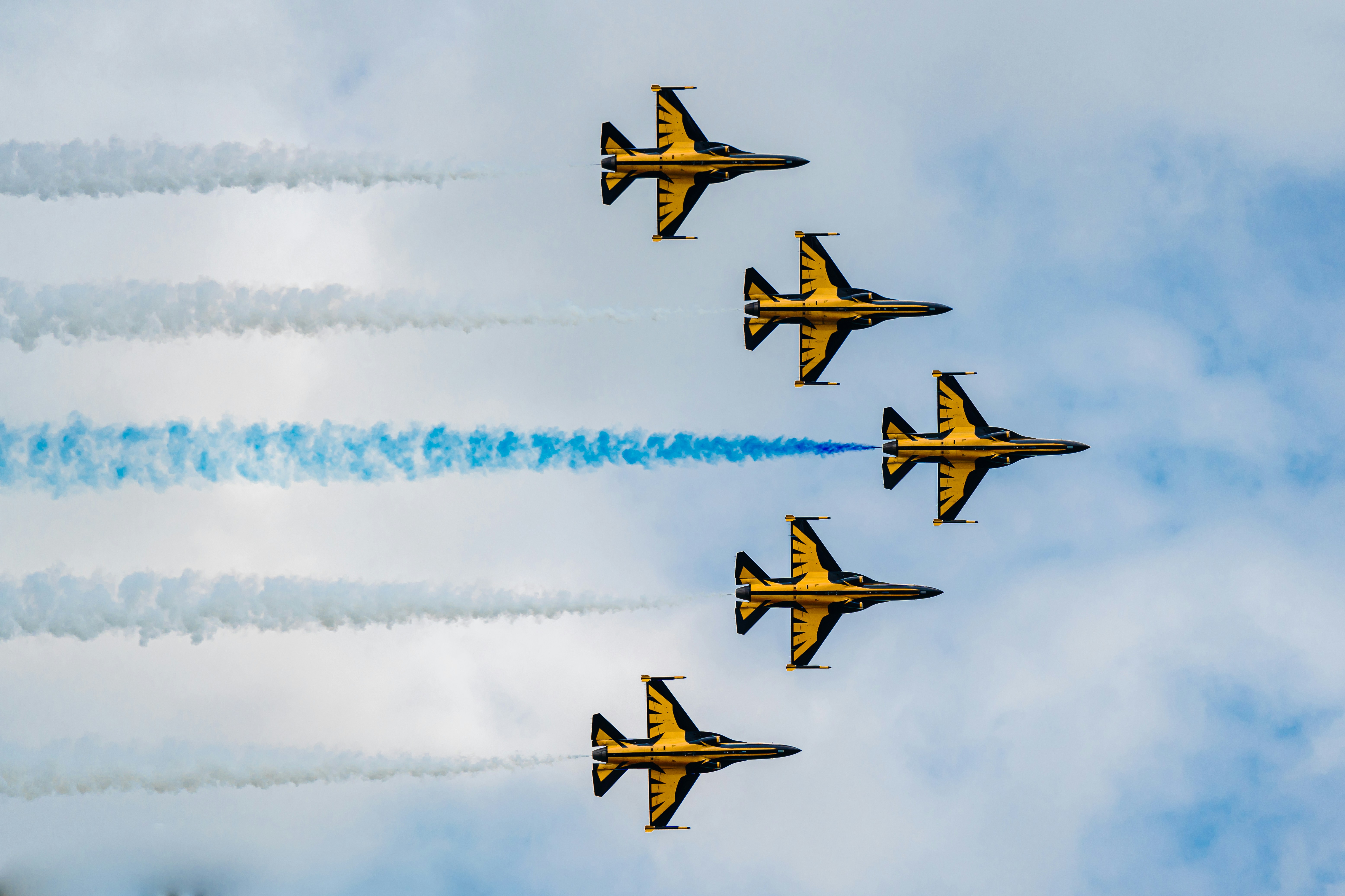 Five Gold Falcons in a Sky-Blue Arc