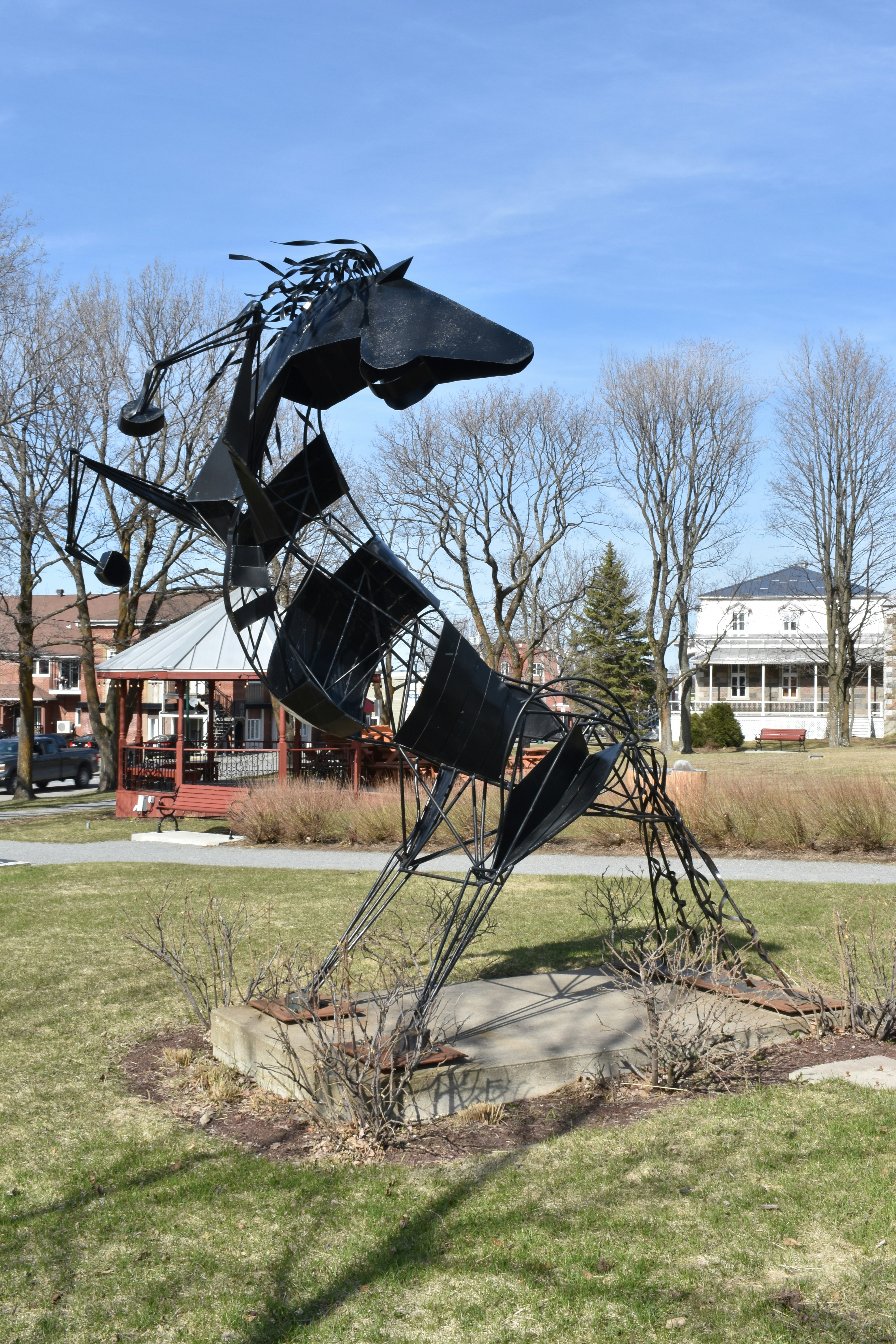 Monolithic Steel Stallion Breaching the Sky