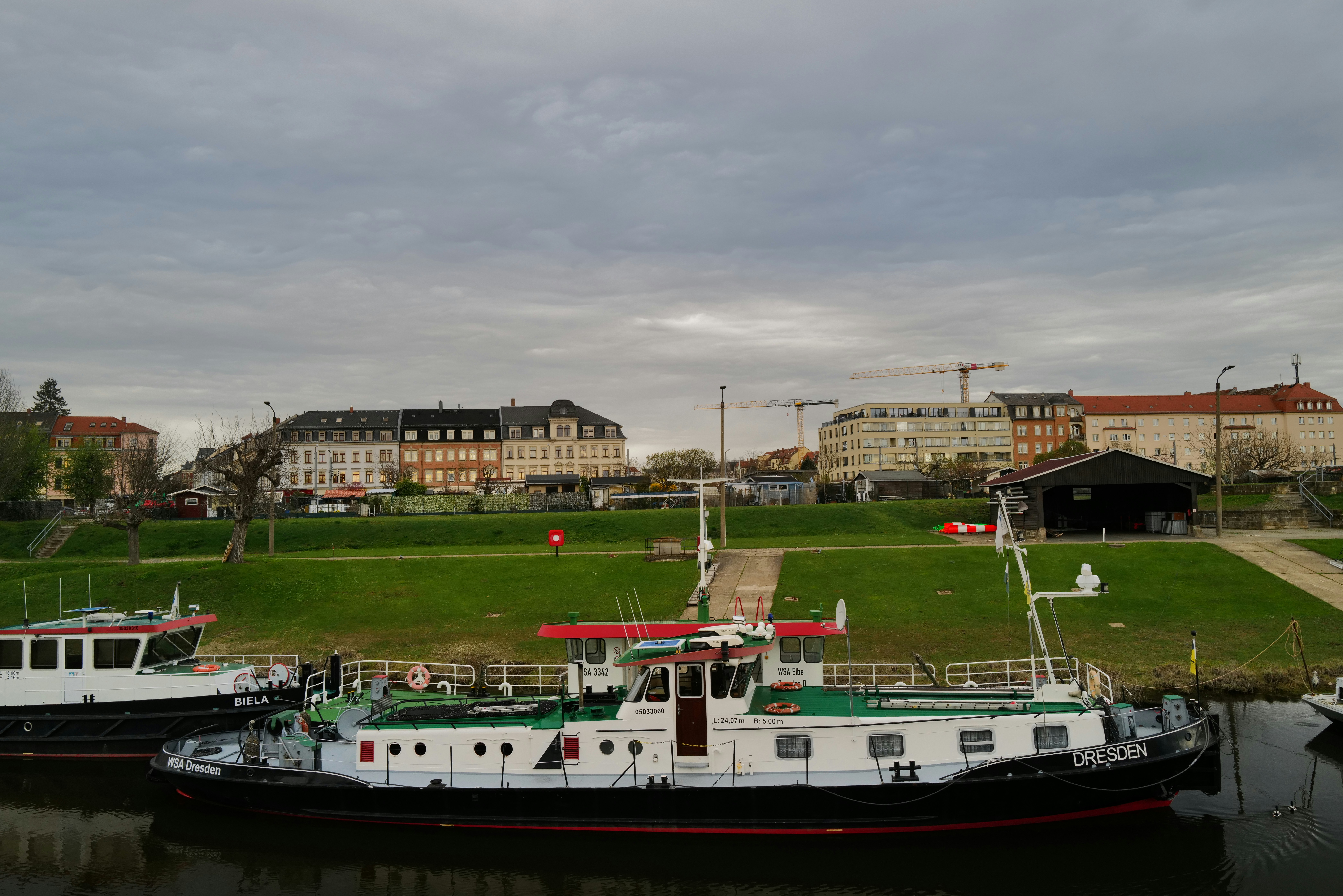 Serene Canal: Boats Resting by the Riverside Park