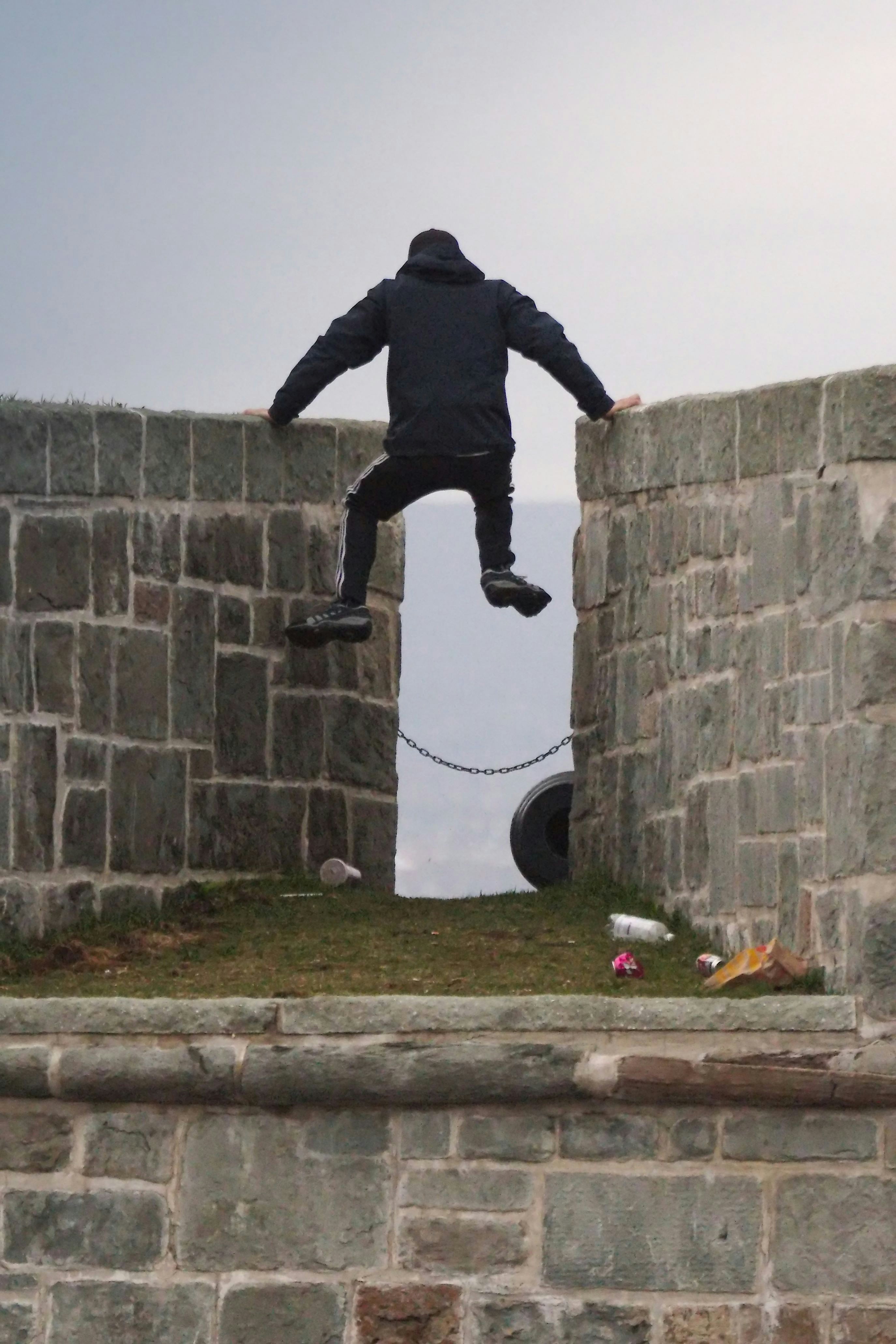 A man jumping off a wall into the air photo – Free Action Image on Unsplash