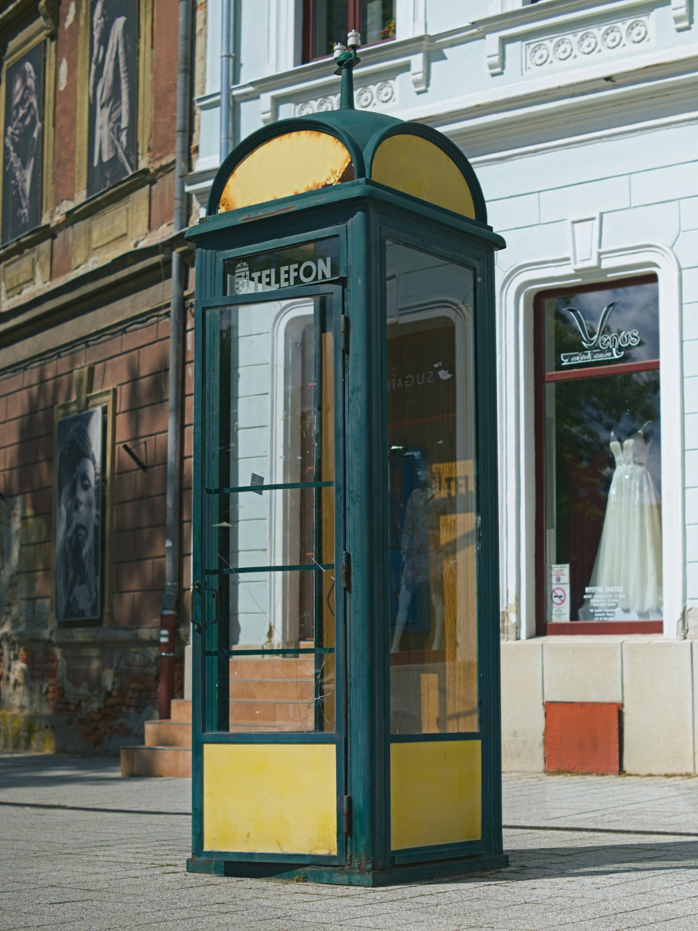 Teal Telephone Booth Framed by a Bridal Shop Window