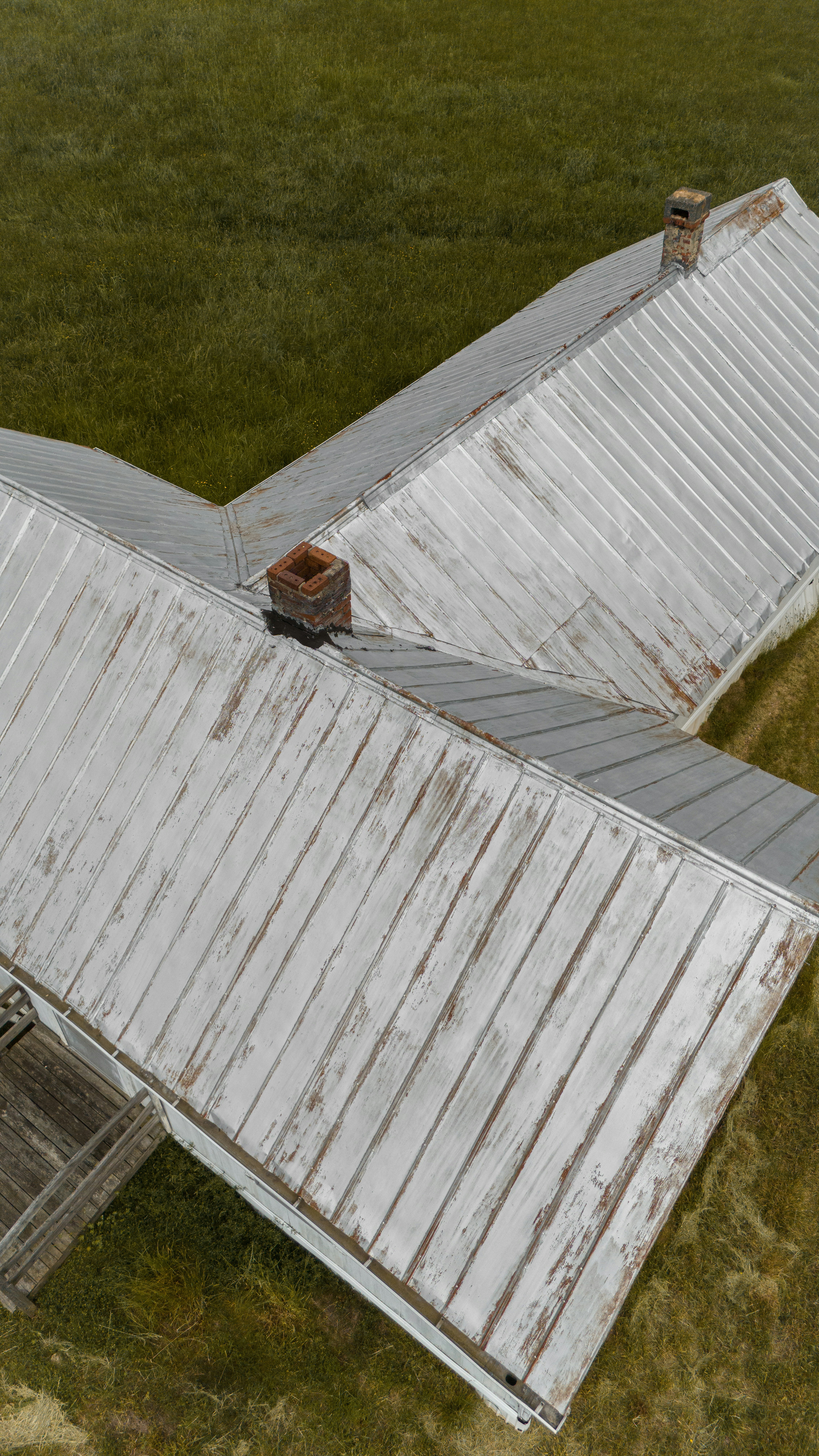 Ridgework and Rust: An Aerial Study of Weathered Metal Roofs