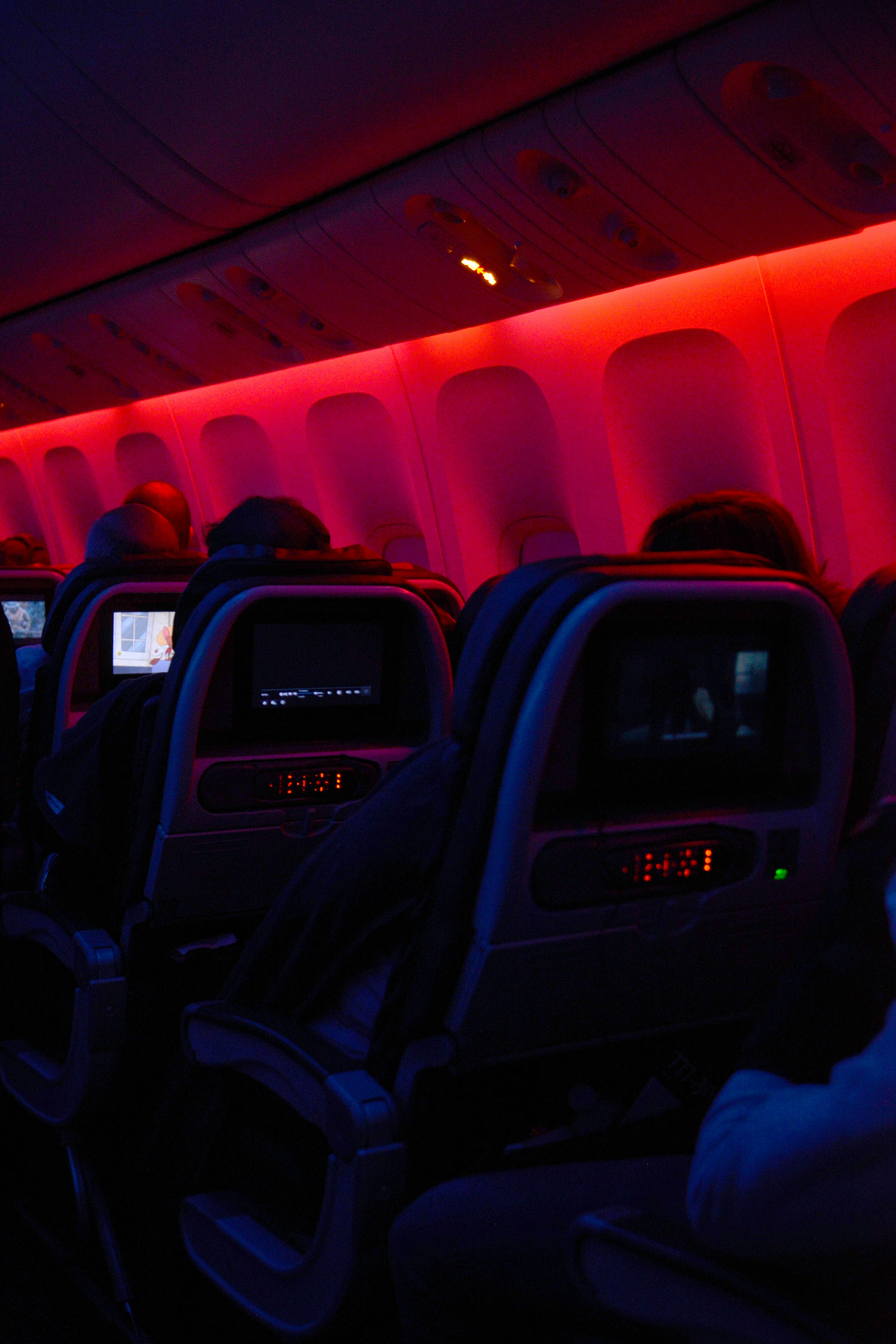 Magenta Aisle: Quiet Neon in a Night Flight Cabin