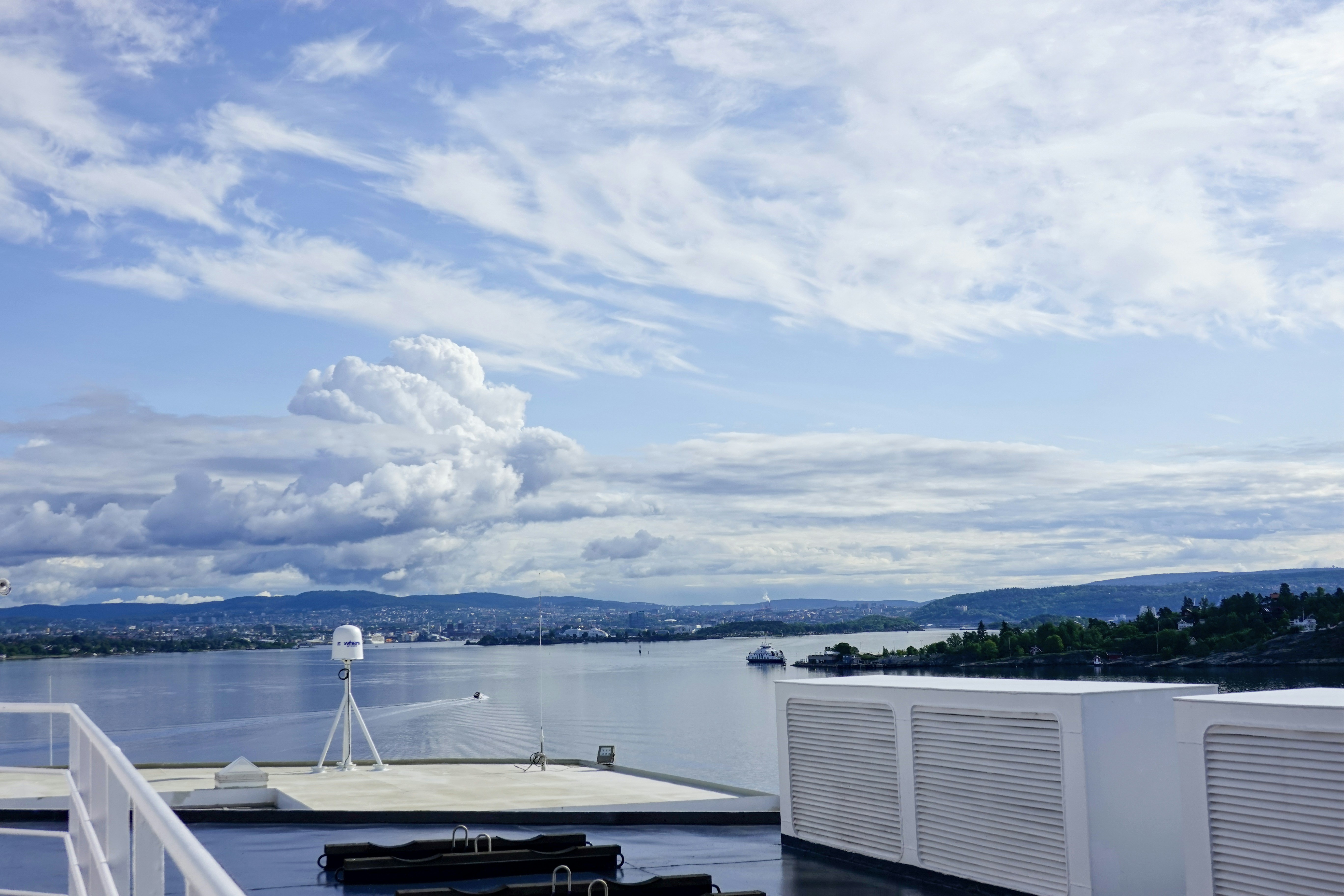 Rooftop Horizon Over Calm Waters