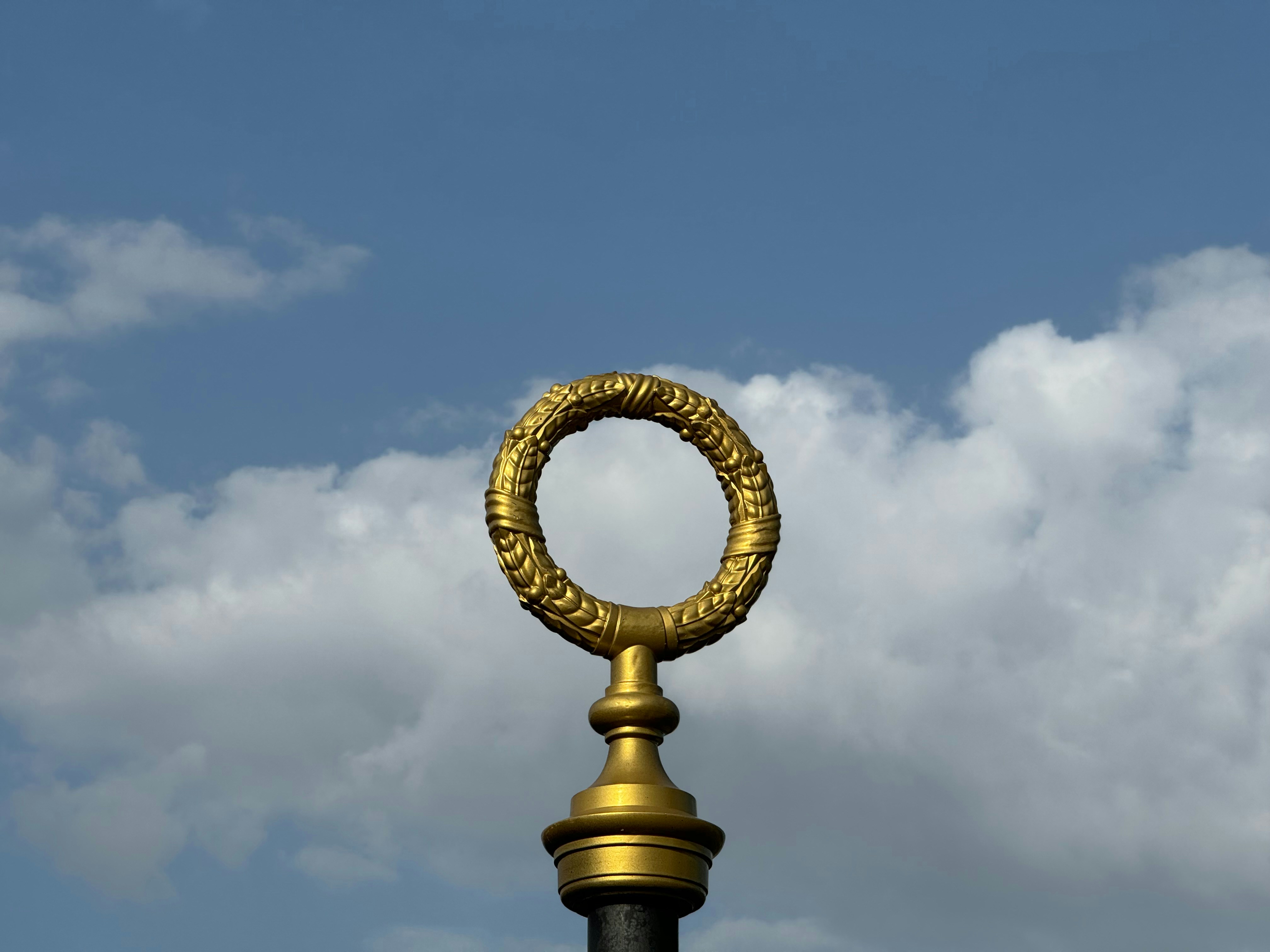 Gilded Ring Finial Reaches for the Sky