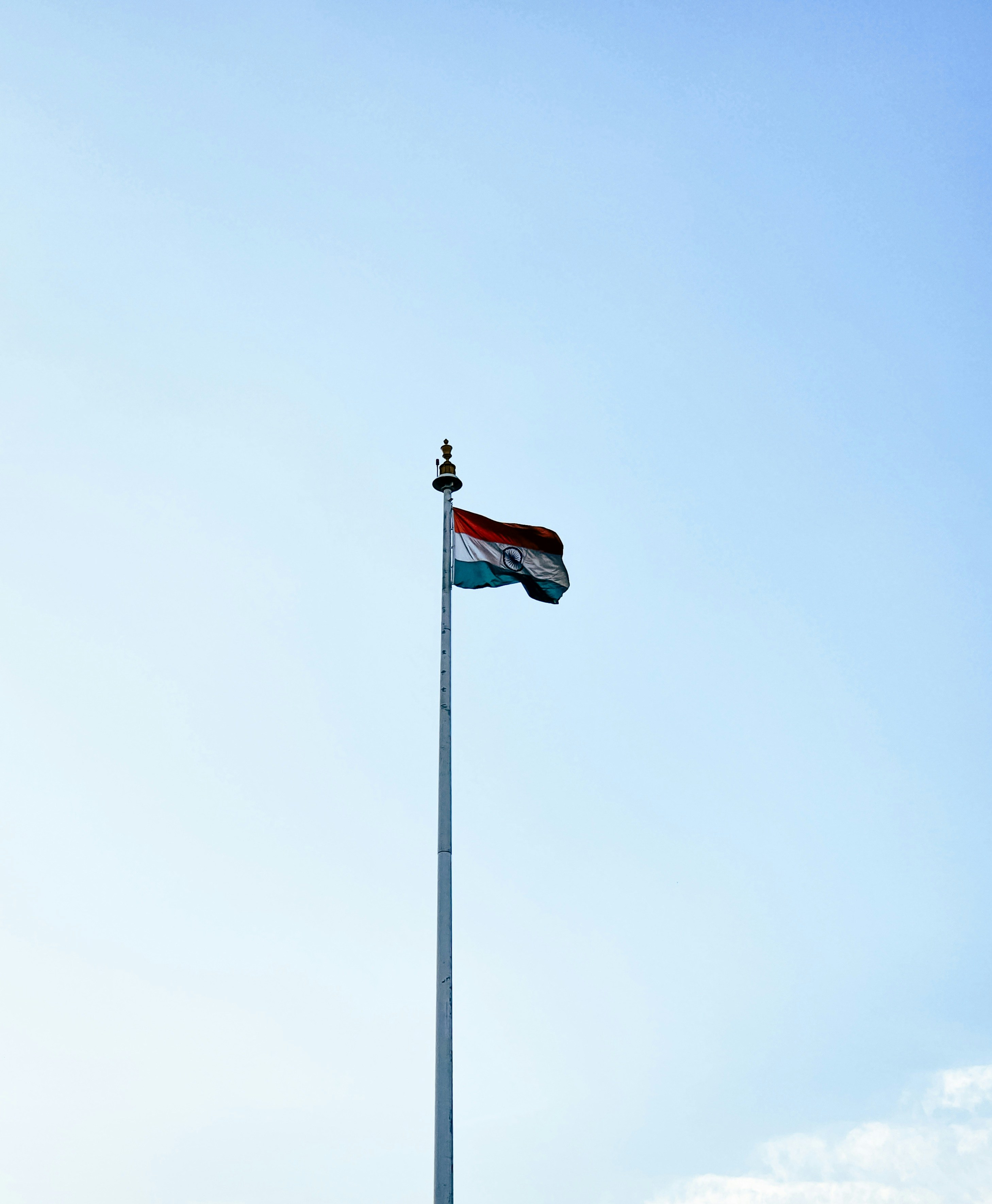 A tall flag pole with a flag on top of it photo – Free India Image on ...