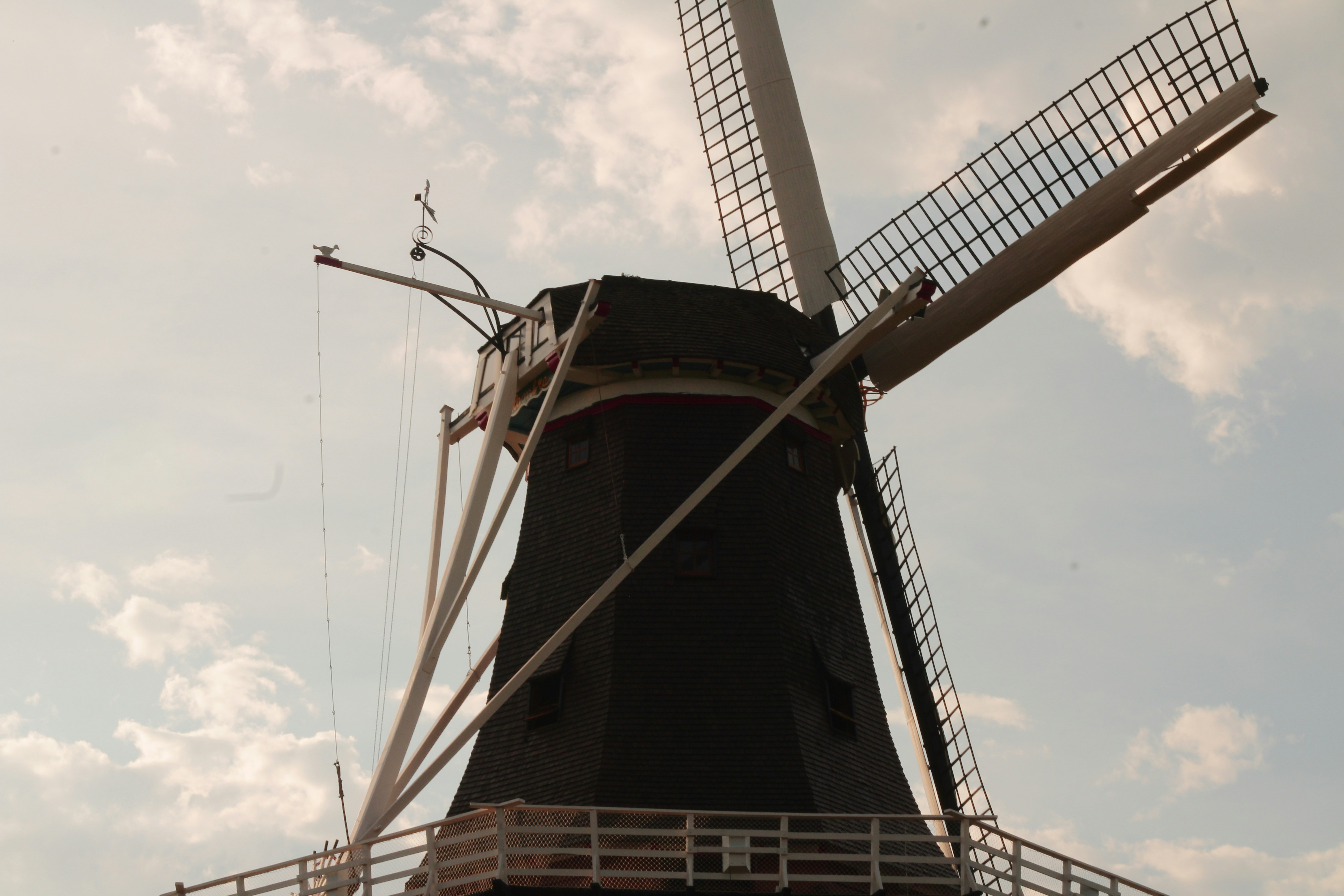 Sail of the Windmill: a weathered tower against a pale blue sky