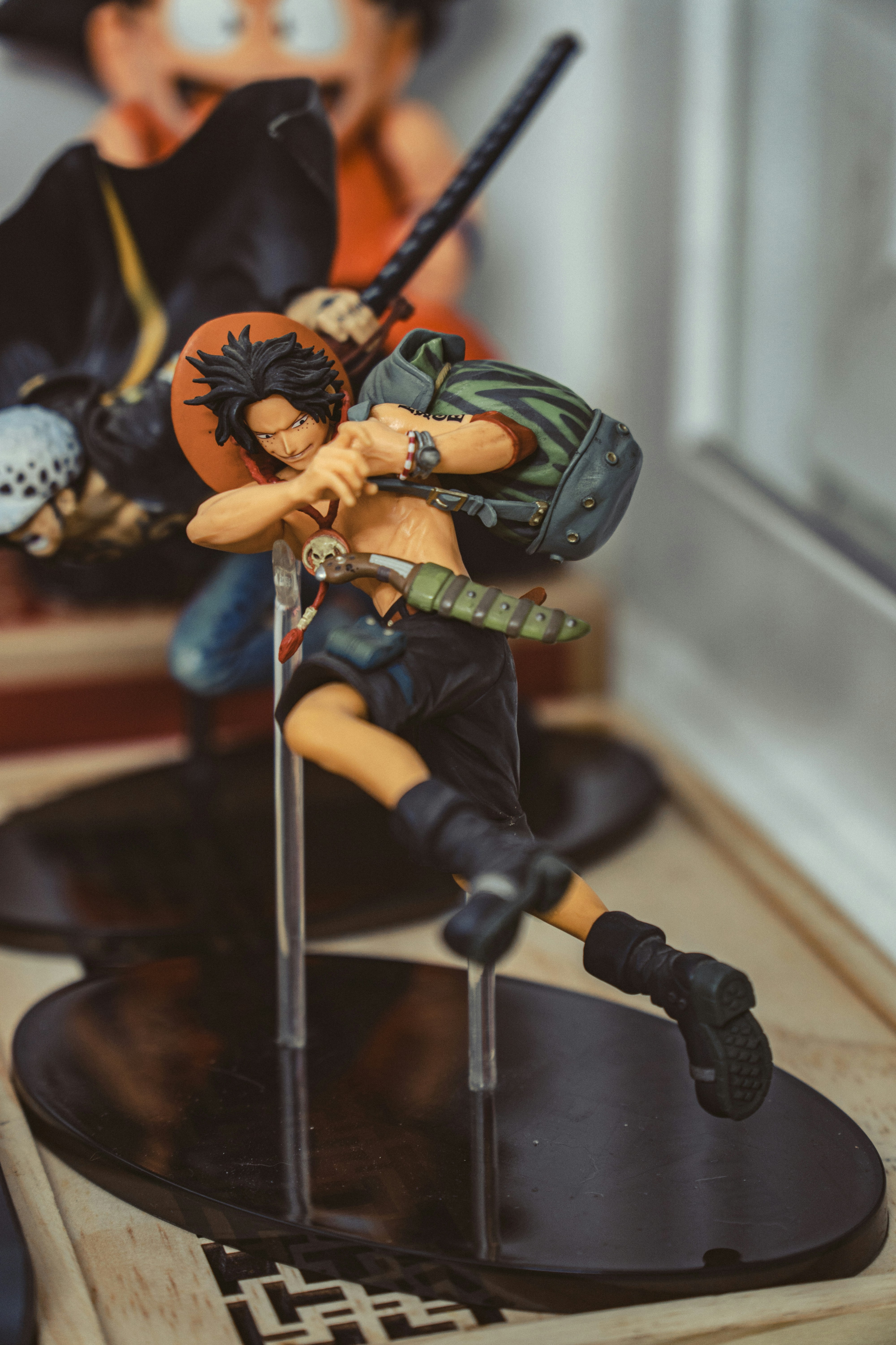 Luffy in Midair: Sword-Wielding Charge on a Black Display Base