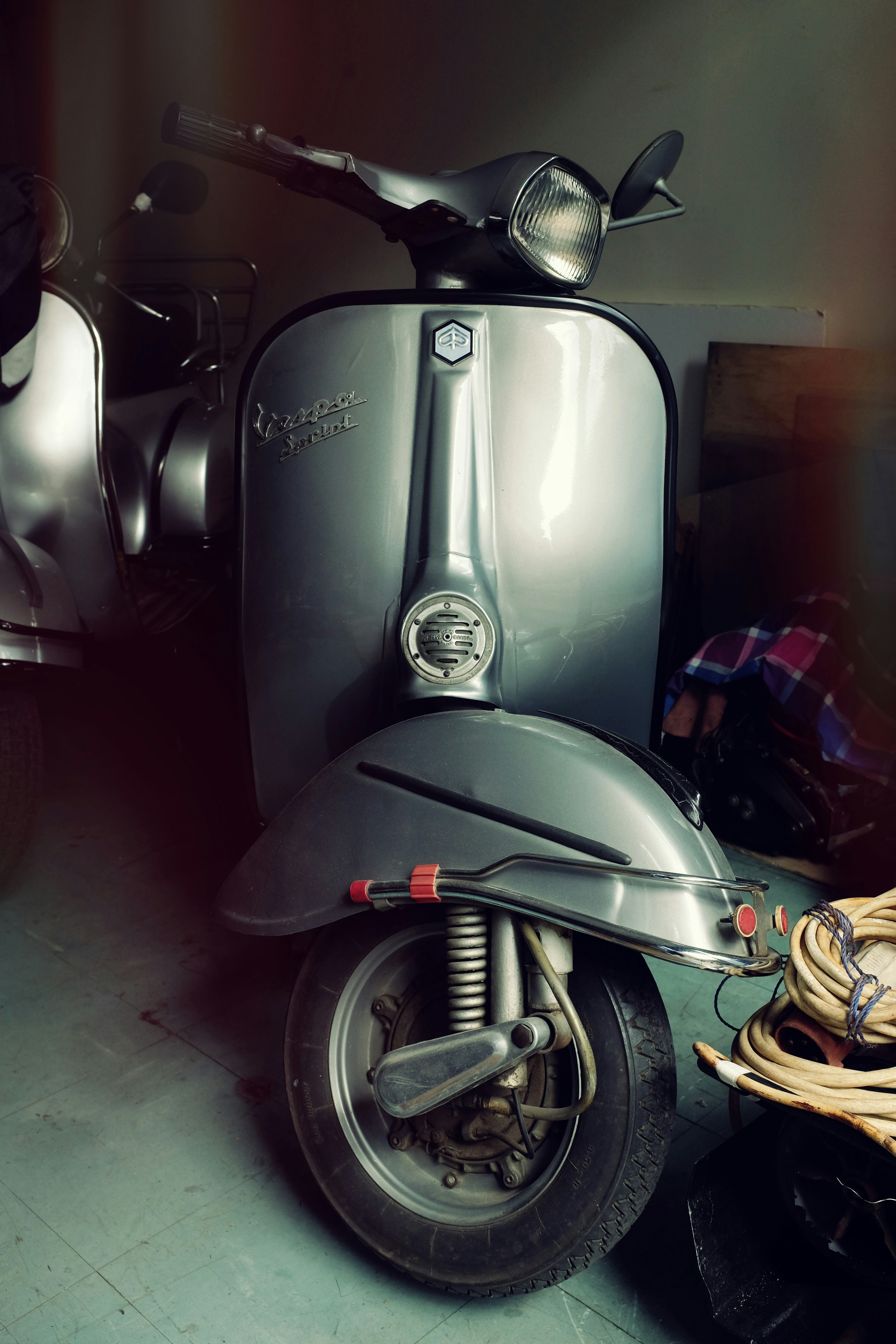 Silvery Vespa in a Quiet Garage: A Portrait of Midcentury Stillness