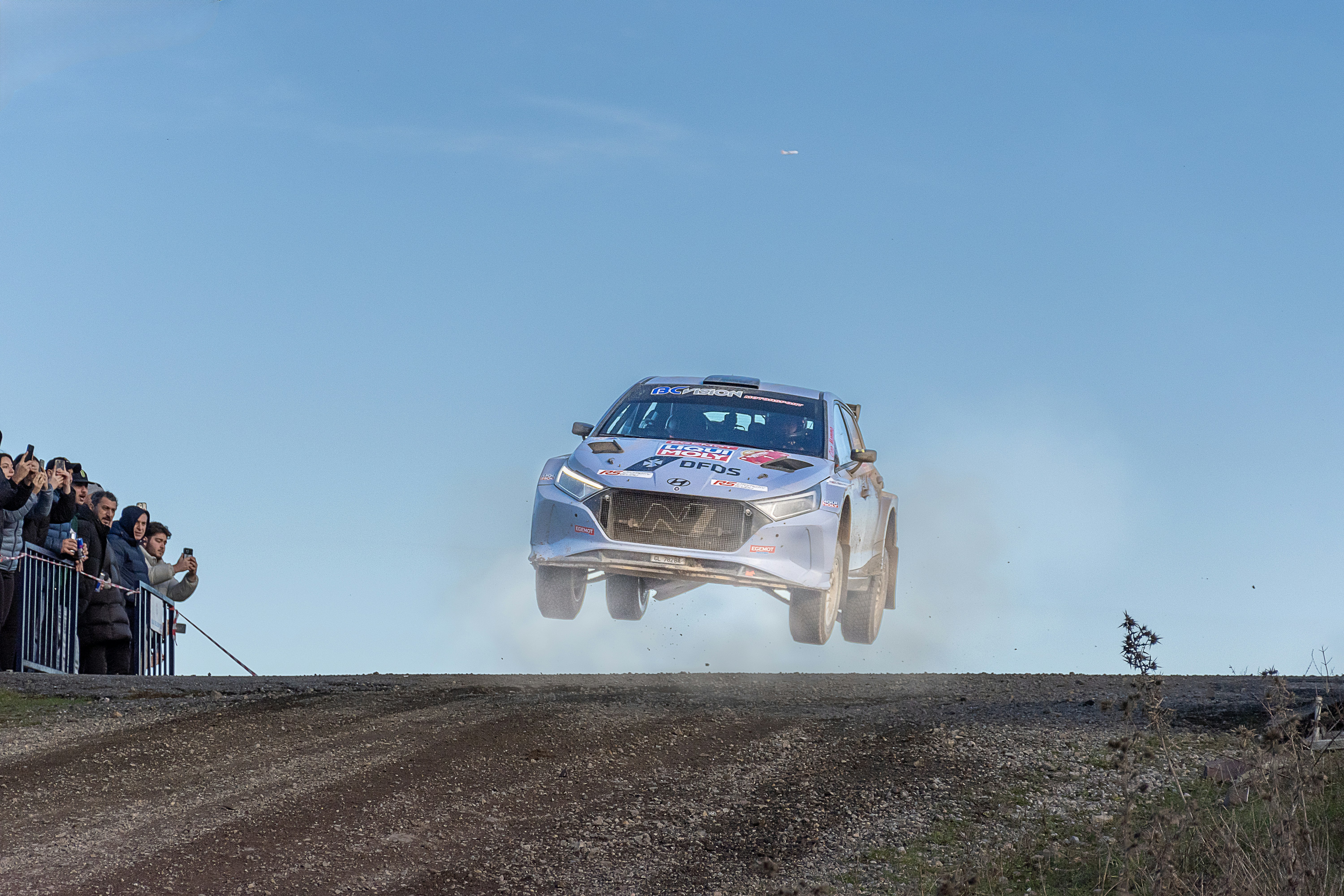 A silver car jumping over a dirt road photo – Free Hyundai i20 Image on ...