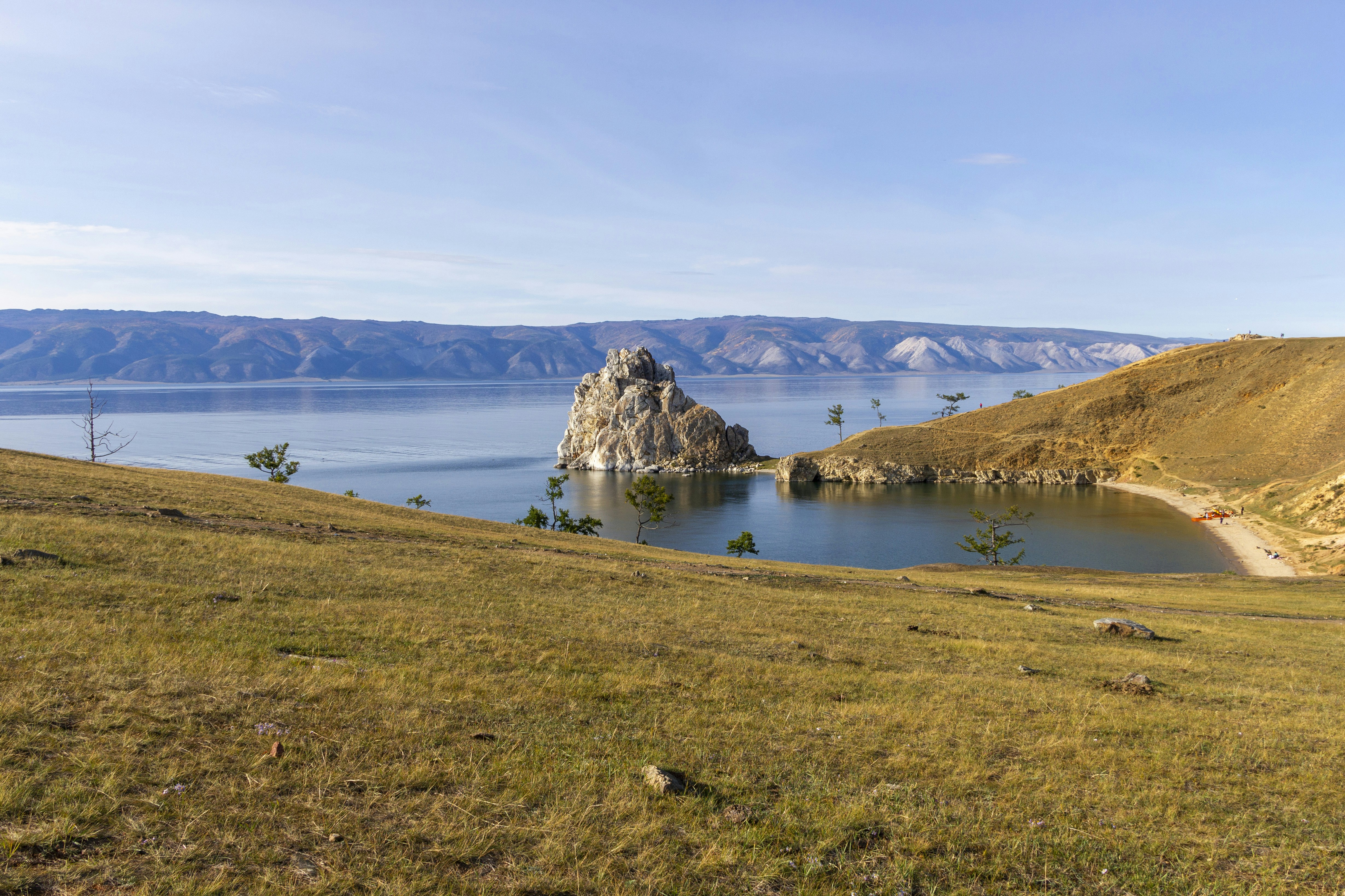 Stone Island Rising from a Serene Lake