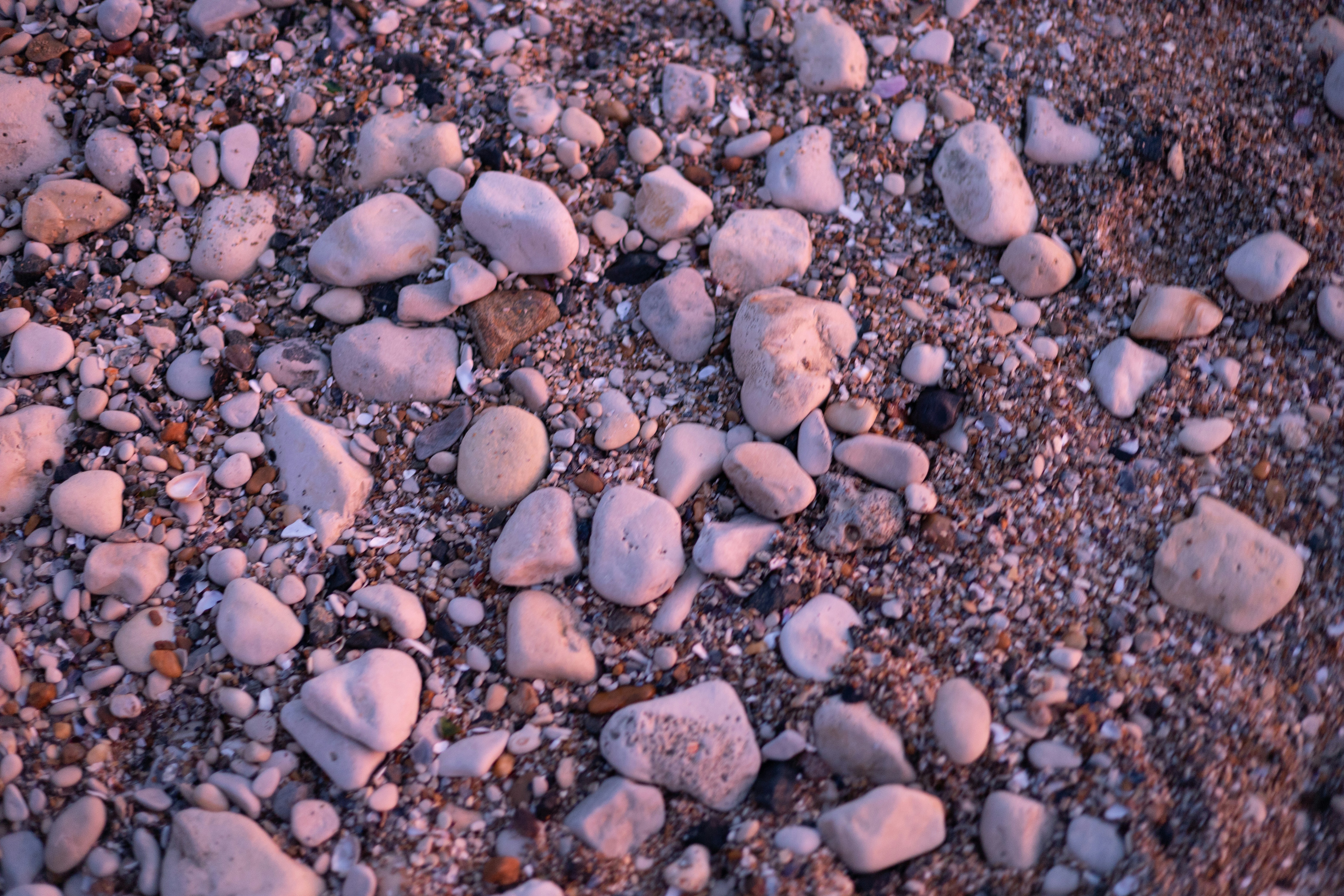 A bunch of rocks that are on the ground photo – Free Stones Image on ...