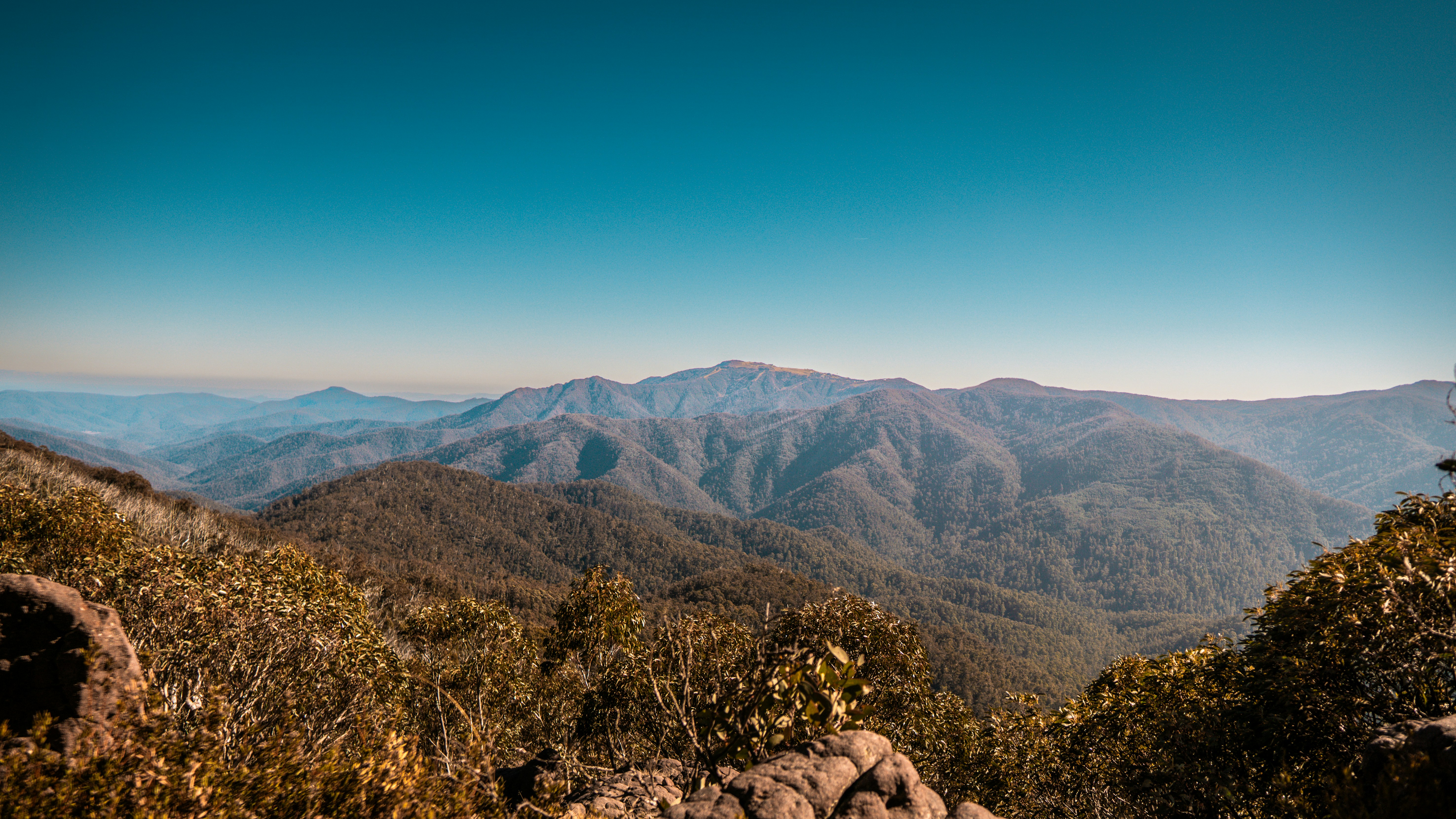 Cerulean Horizon Over the Ridge of Distant Peaks