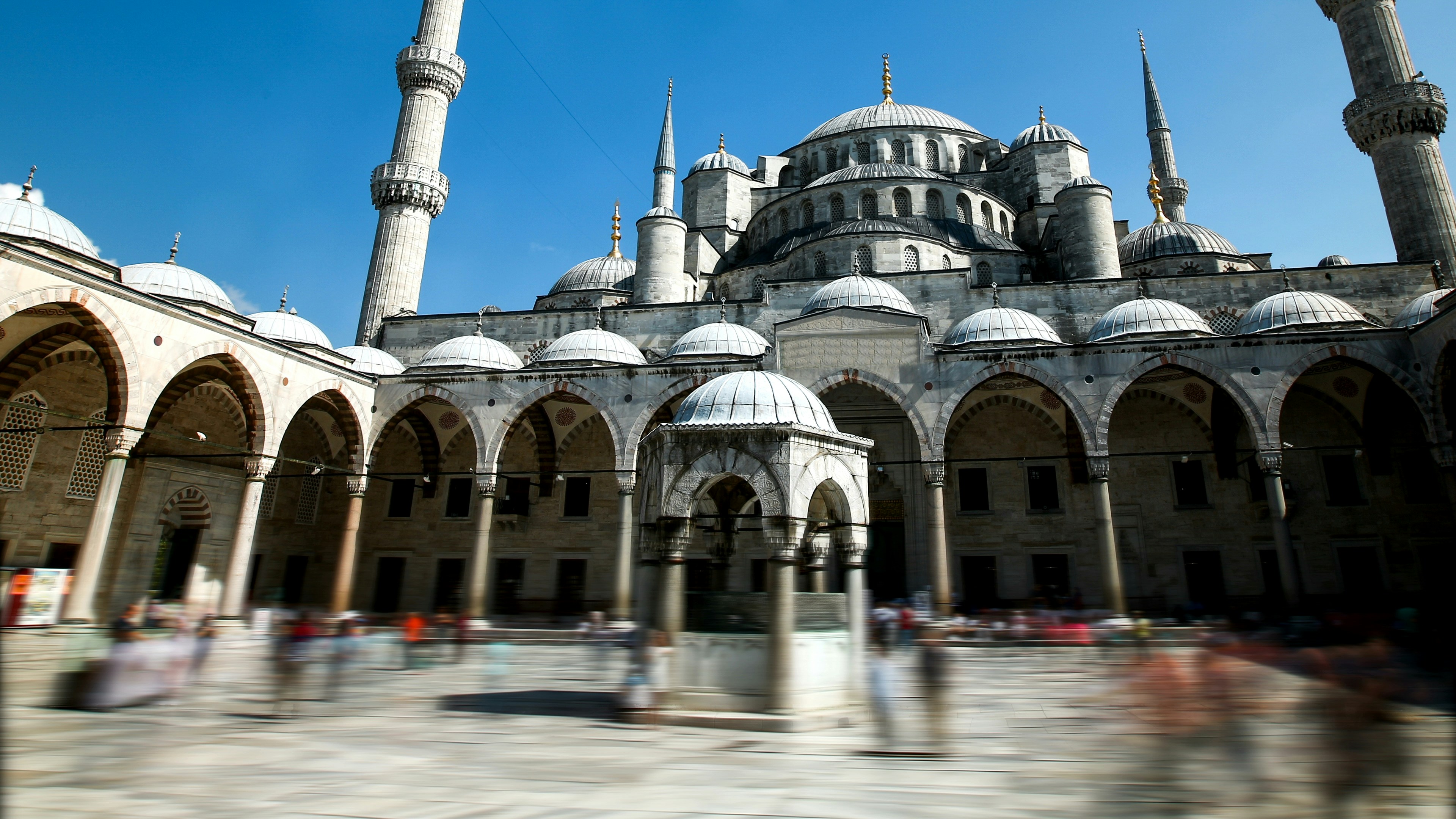 A large building with many pillars and arches photo – Free Building ...