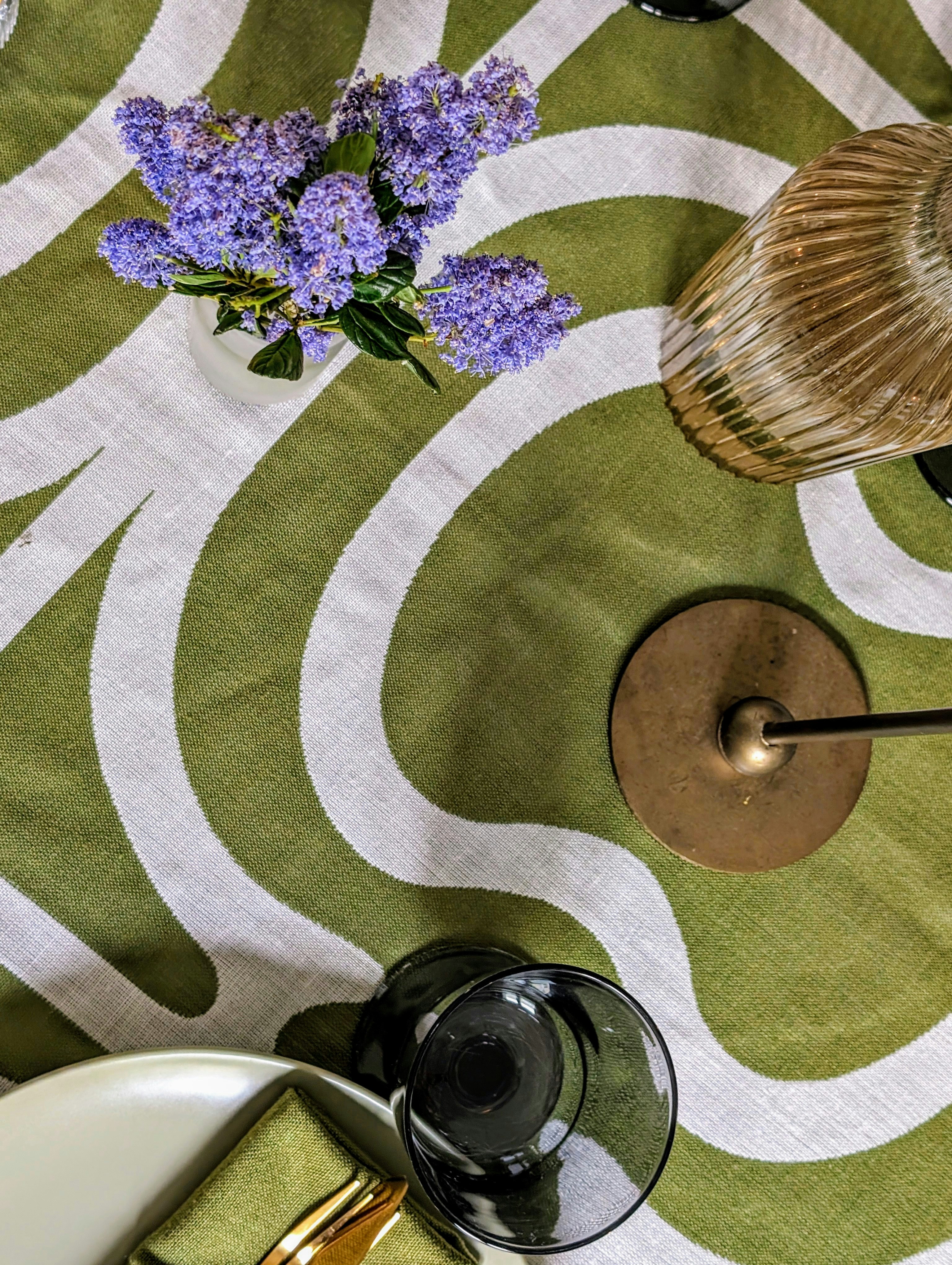 Lilac Burst on a Swirl-Pattern Tablecloth: A Quiet Tabletop Still-Life
