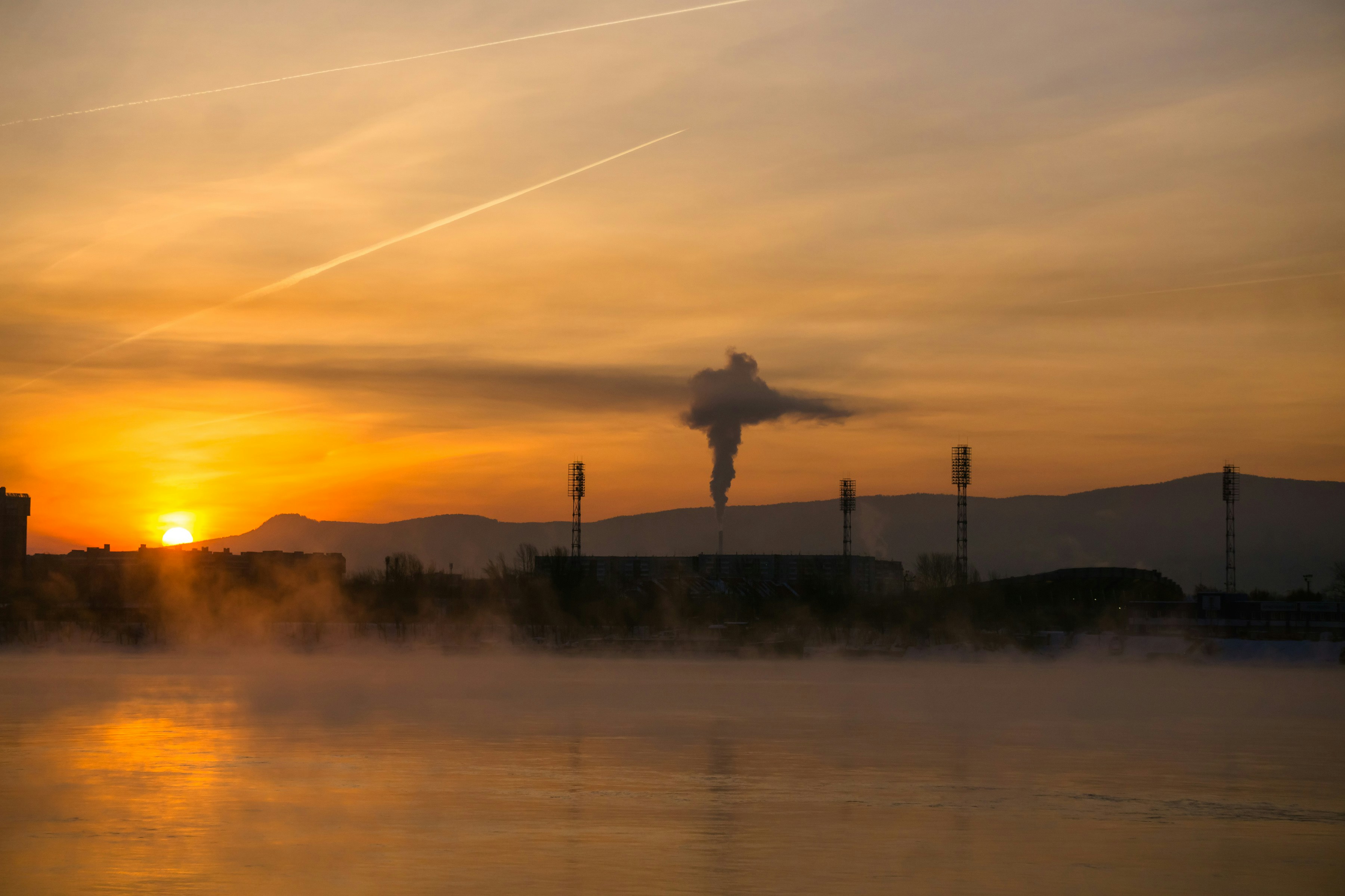 Dawn Steam Over a Quiet Industrial Horizon