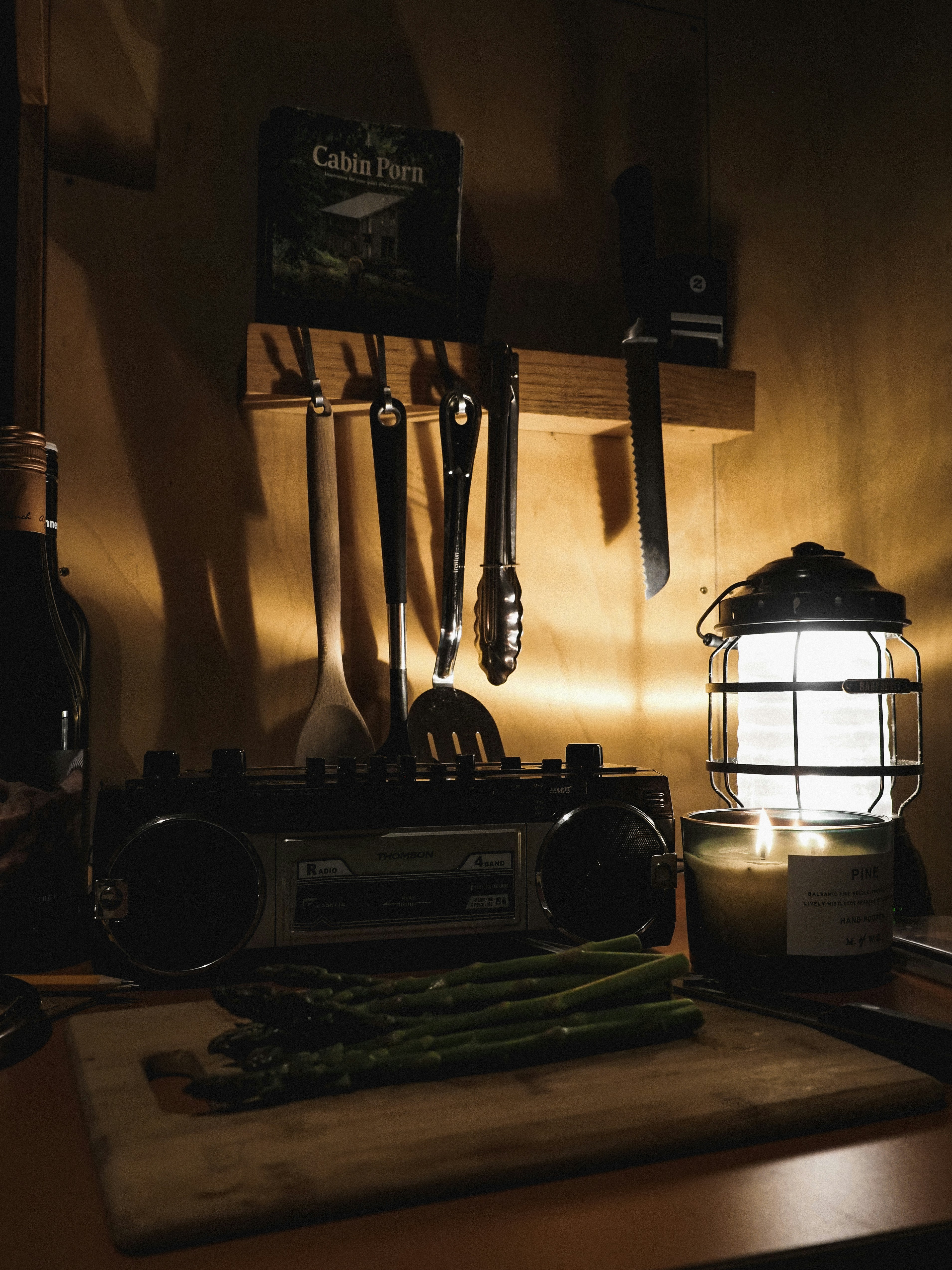 Lantern Glow Over a Rustic Counter: Asparagus on Wood with a Vintage Boombox