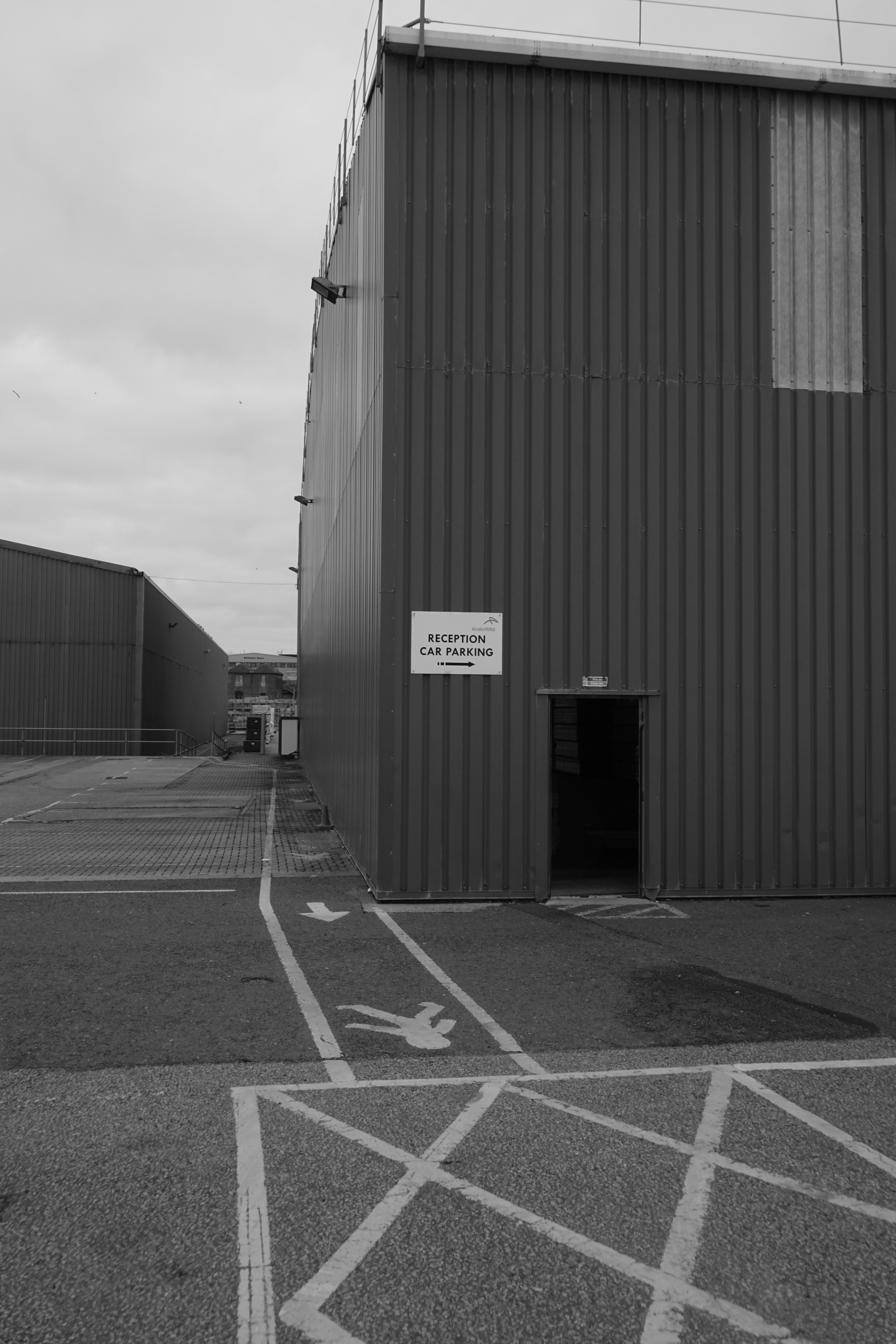 Open Door at the Edge of the Complex: Monochrome Industrial Geometry