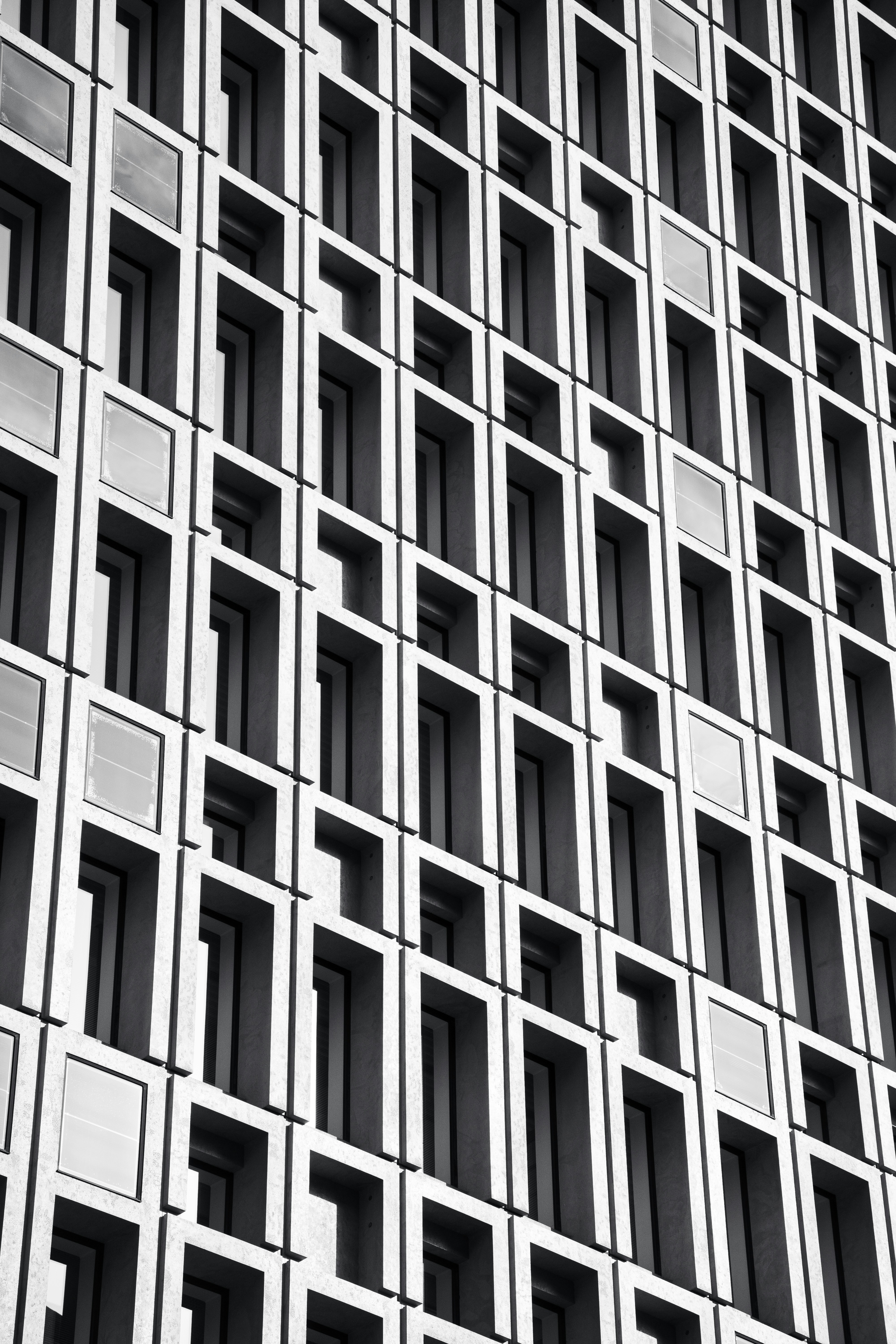 A very tall building with lots of windows photo – Free Grey Image on ...