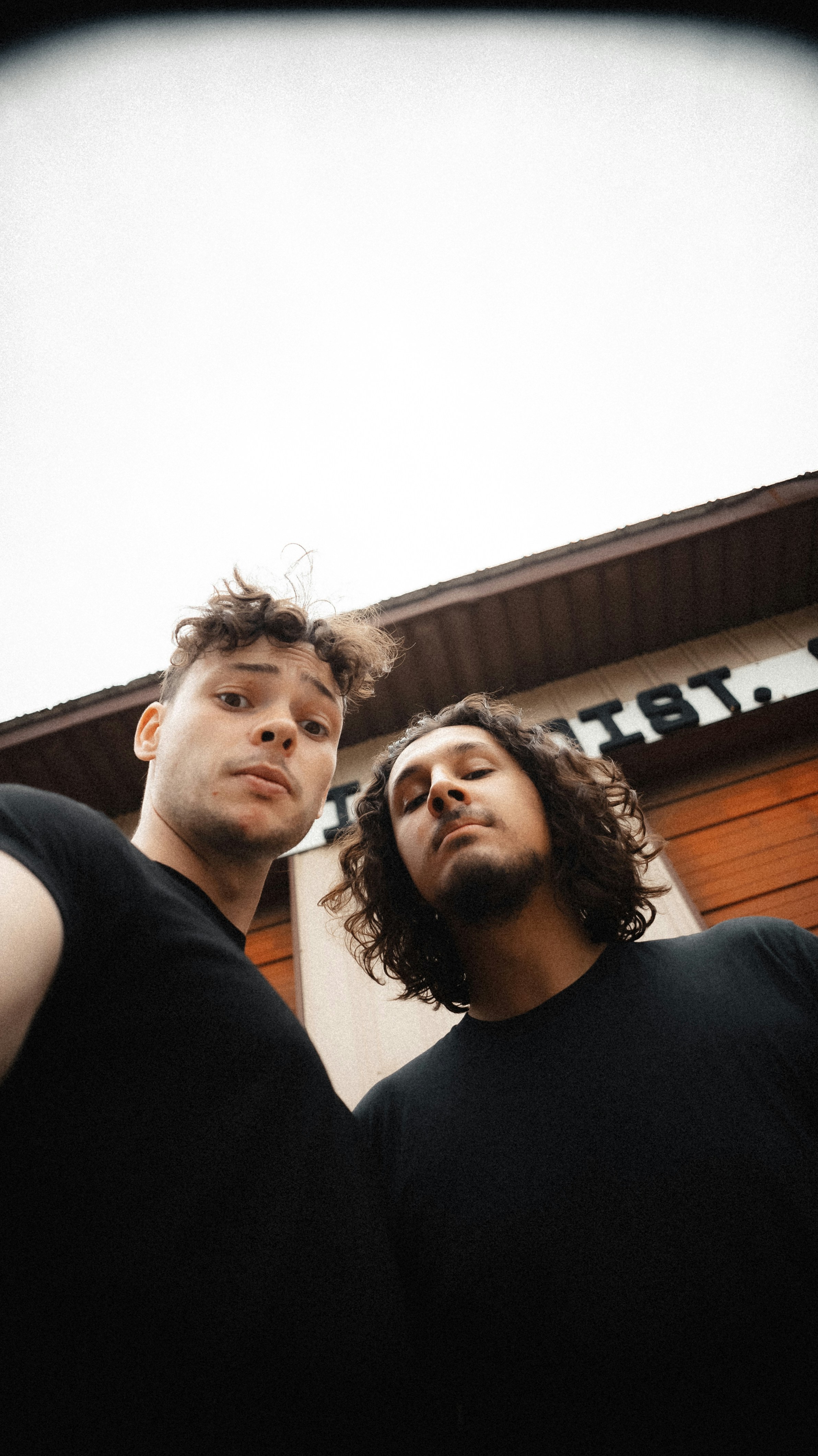 Low-Angle Duo: Portraits from a Street-Level Perspective