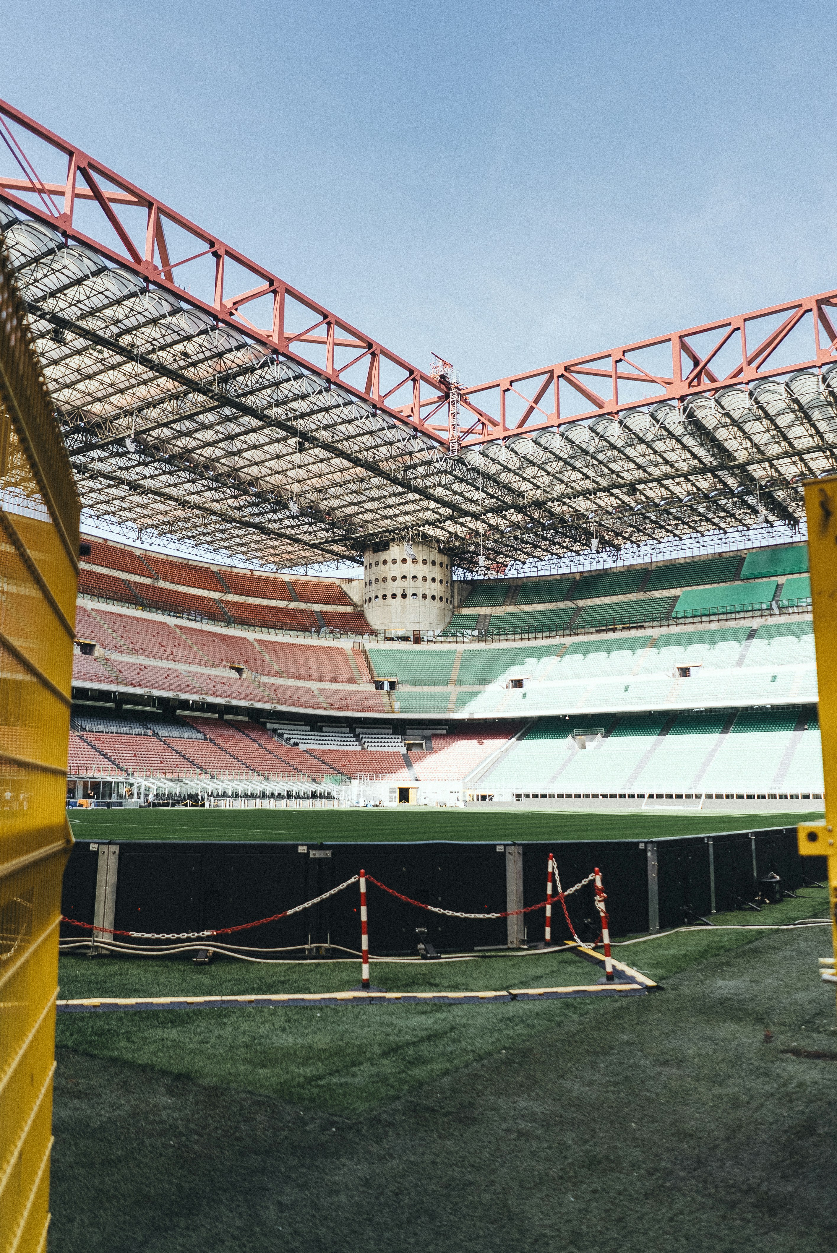 Center Ring Amid Red Lattice: A Stadium's Quiet Construction Vista