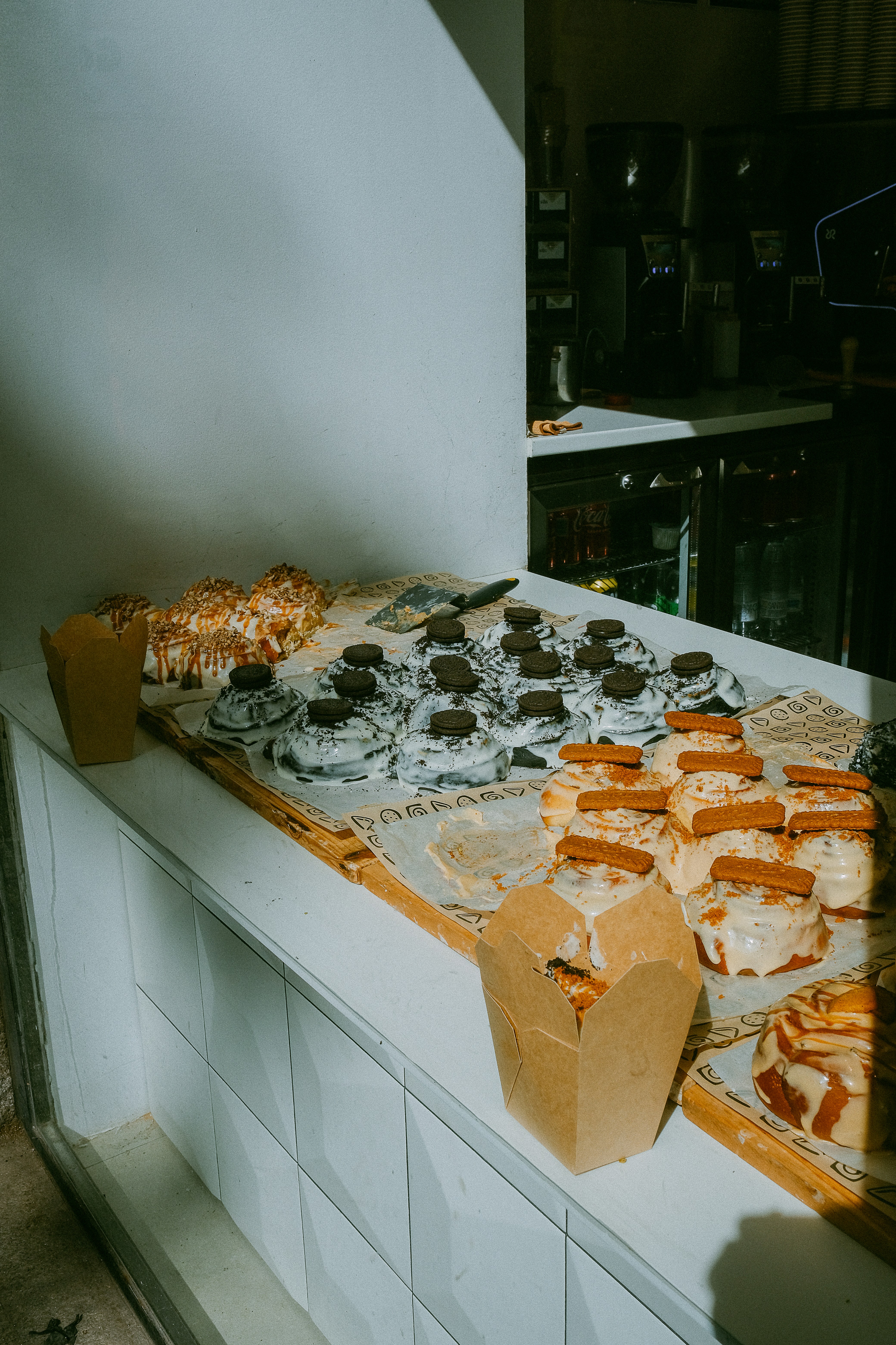 Oreo-Crowned Treats Parade Along a Quiet Bakery Counter