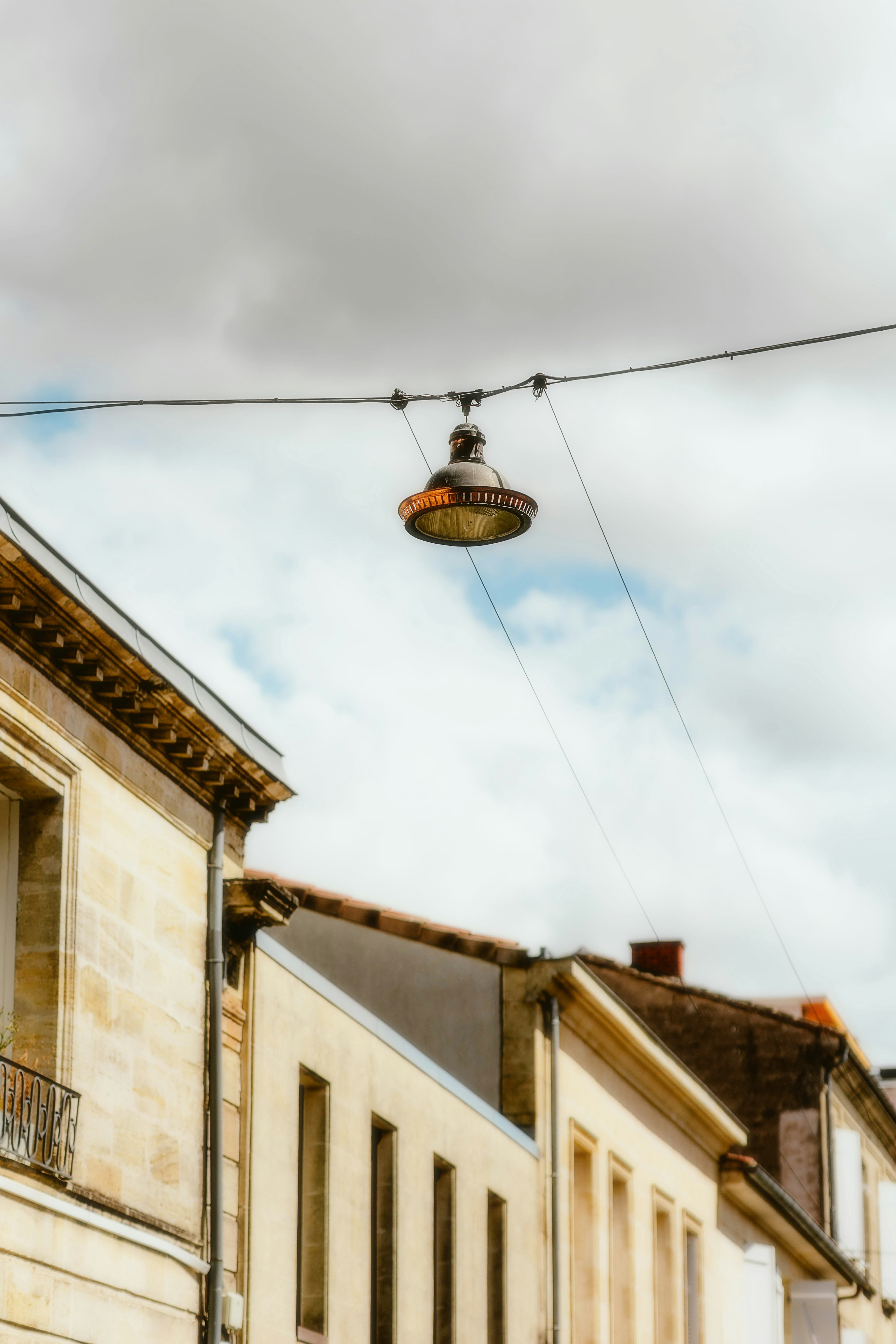 Suspended Glow Over a Sunlit Stone Street