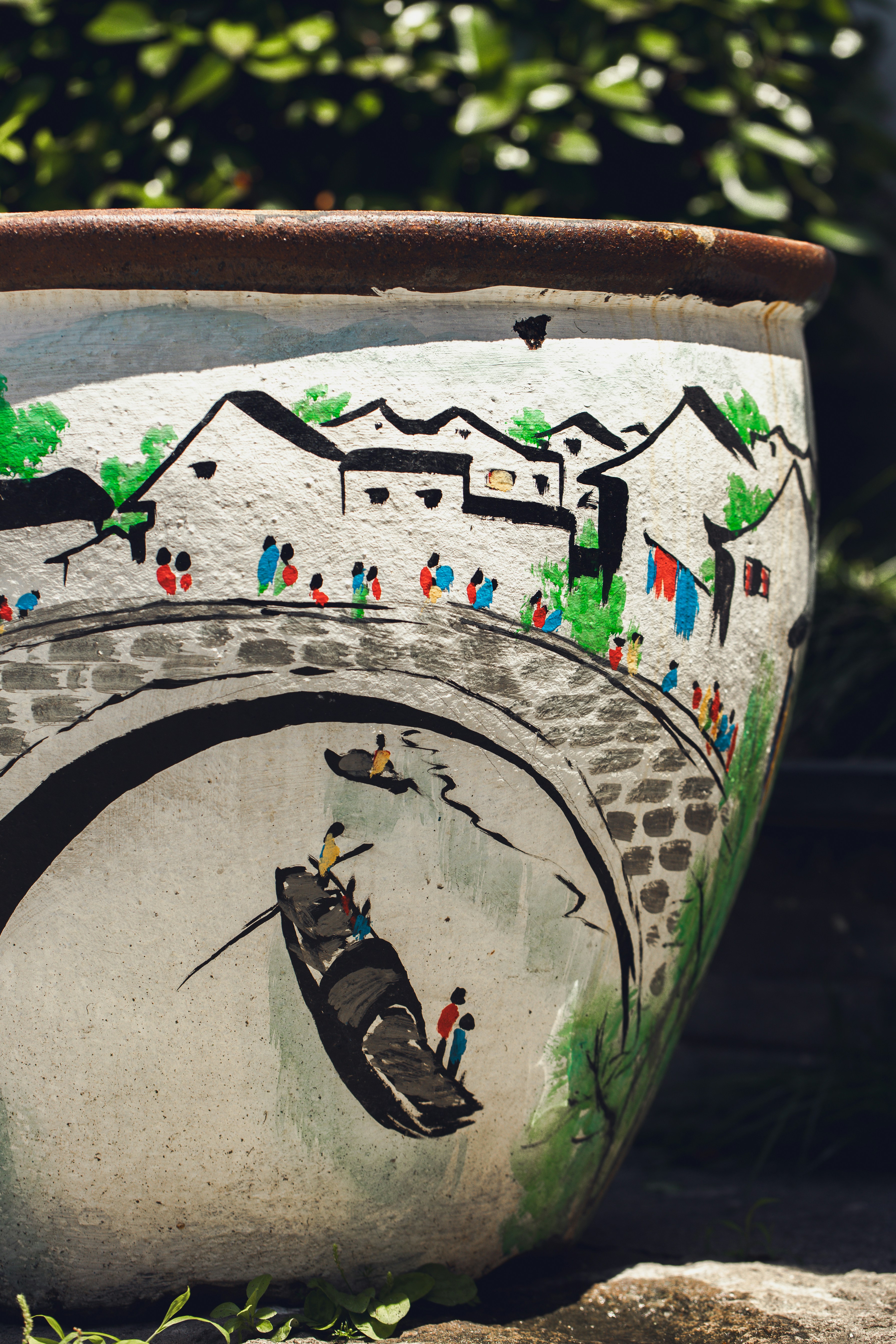 Bridge of Clay: A Riverside Scene Winding Around a Painted Pot