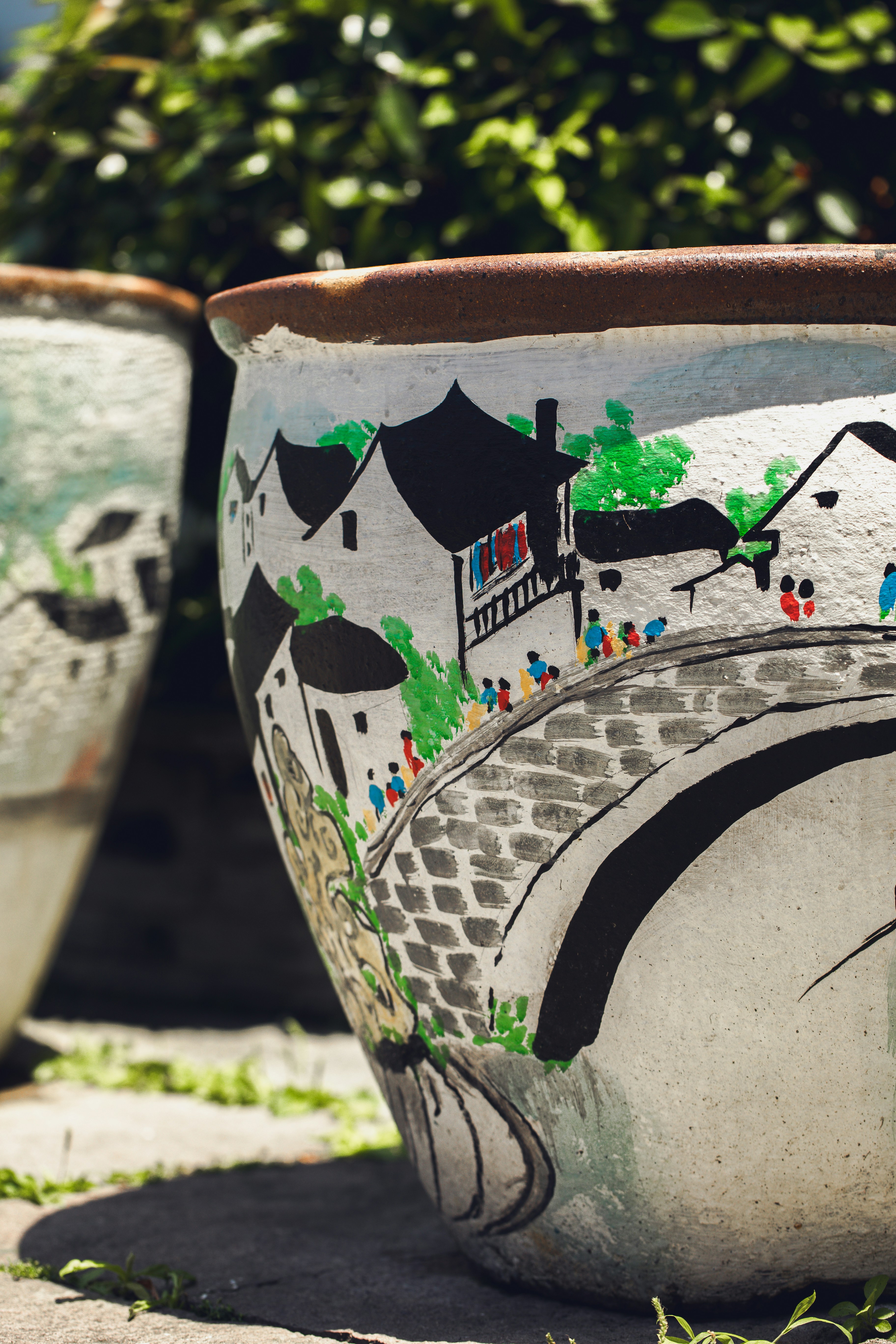 Bridge in Clay: A Village Winds Around a Painted Planter
