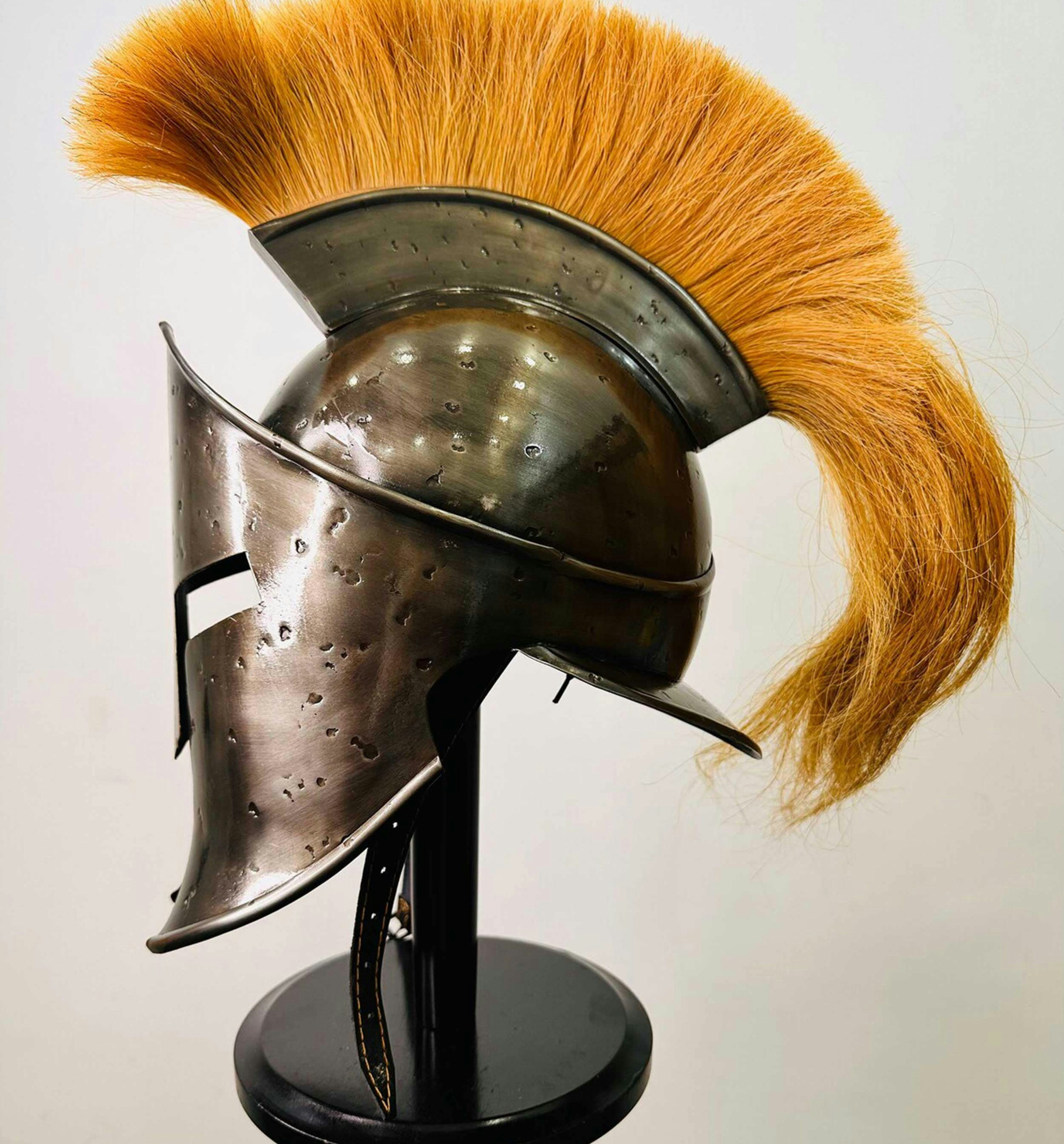 A helmet with a yellow hair on top of it photo – Free Medival Image on ...