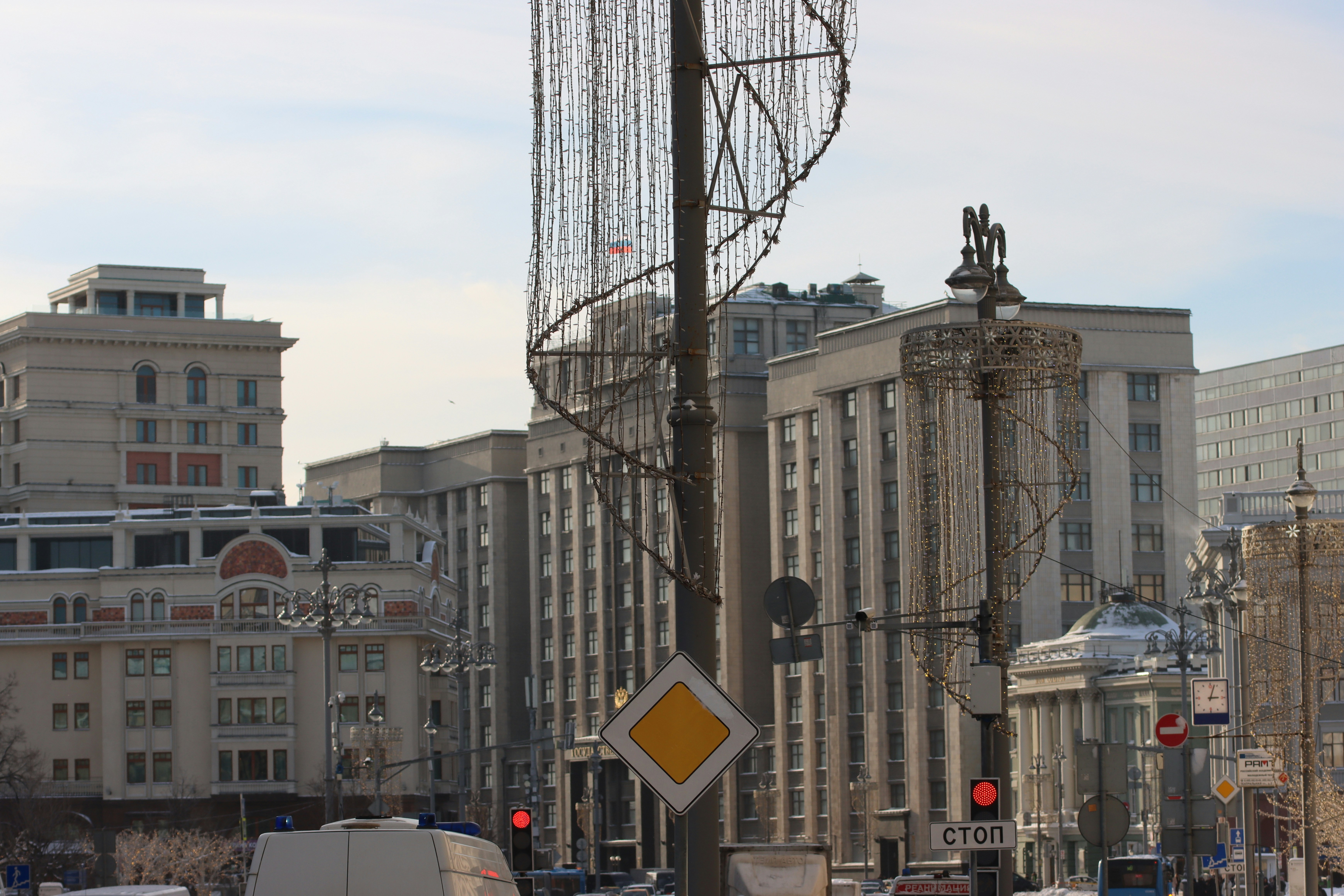 Crossroads in Daylight: A City Street Framed by Glass and Brick