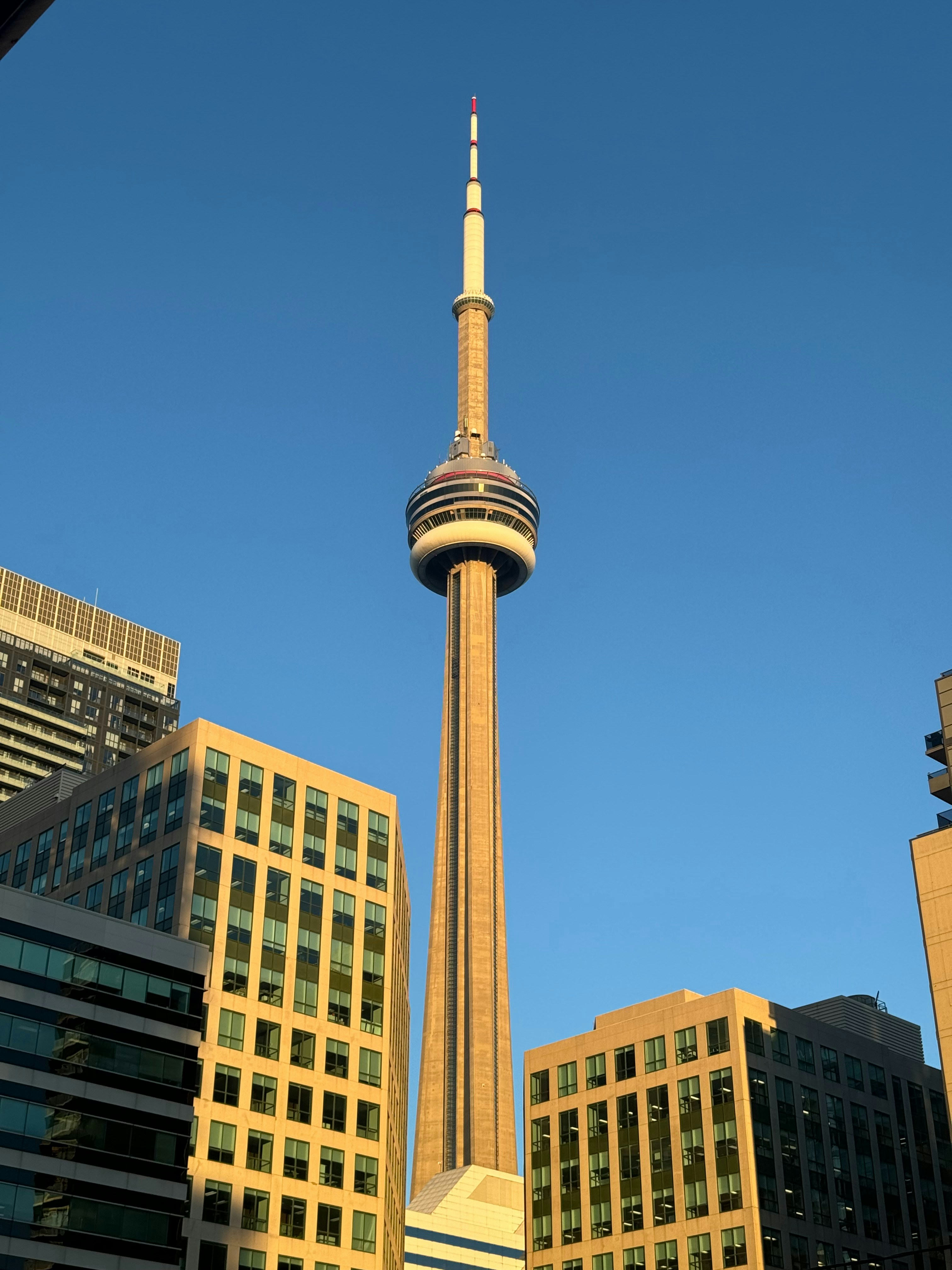 Vertical Beacon Over Toronto: The CN Tower Among Glass and Sky