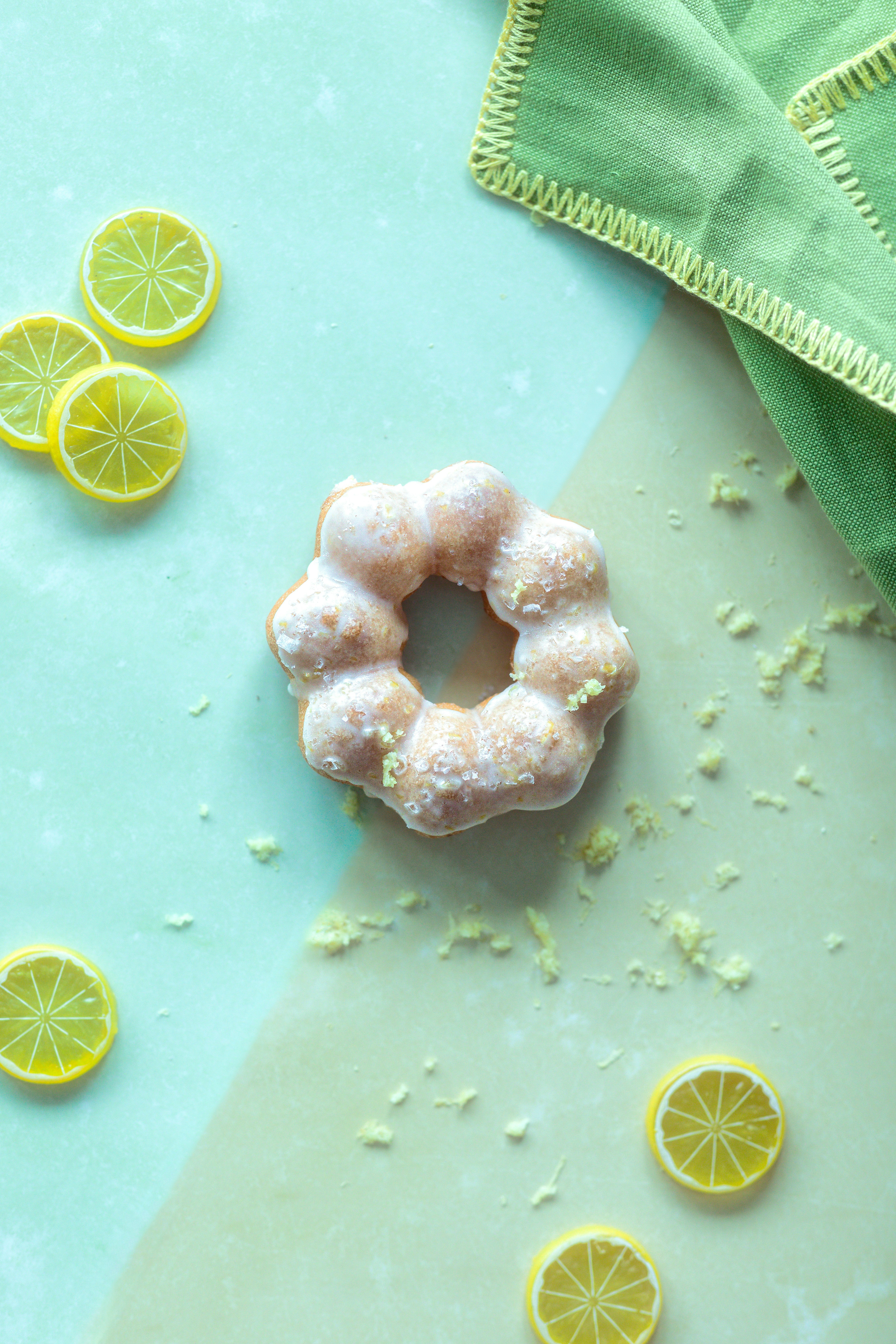 Zest and Ring: A Lime-Glazed Donut on a Minty Studio Canvas