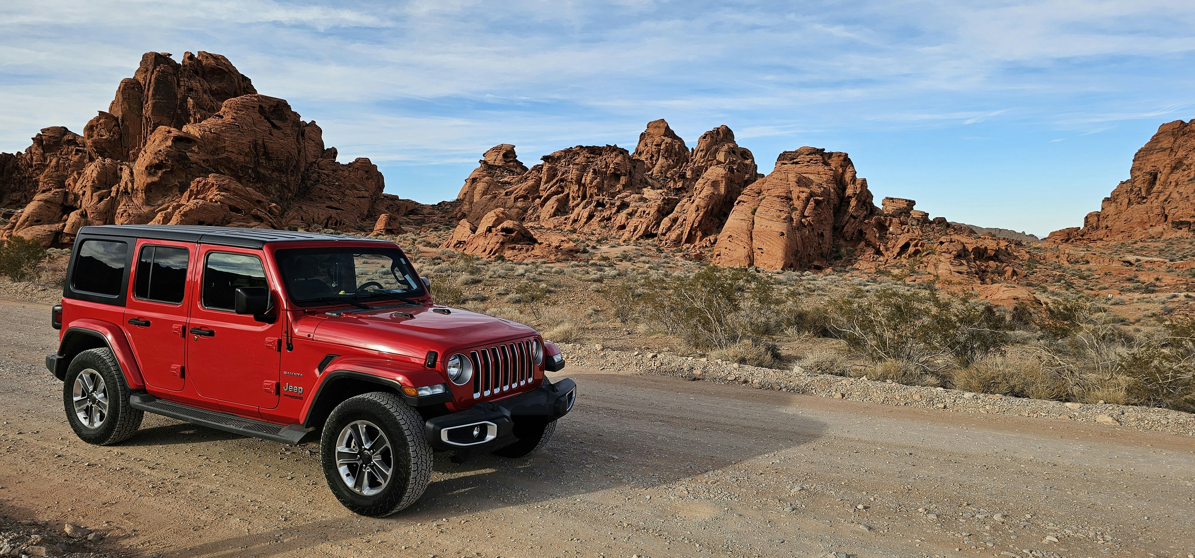 Crimson Wrangler at Desert Ridge: A Red Jeep Among Monolithic Rock Arches