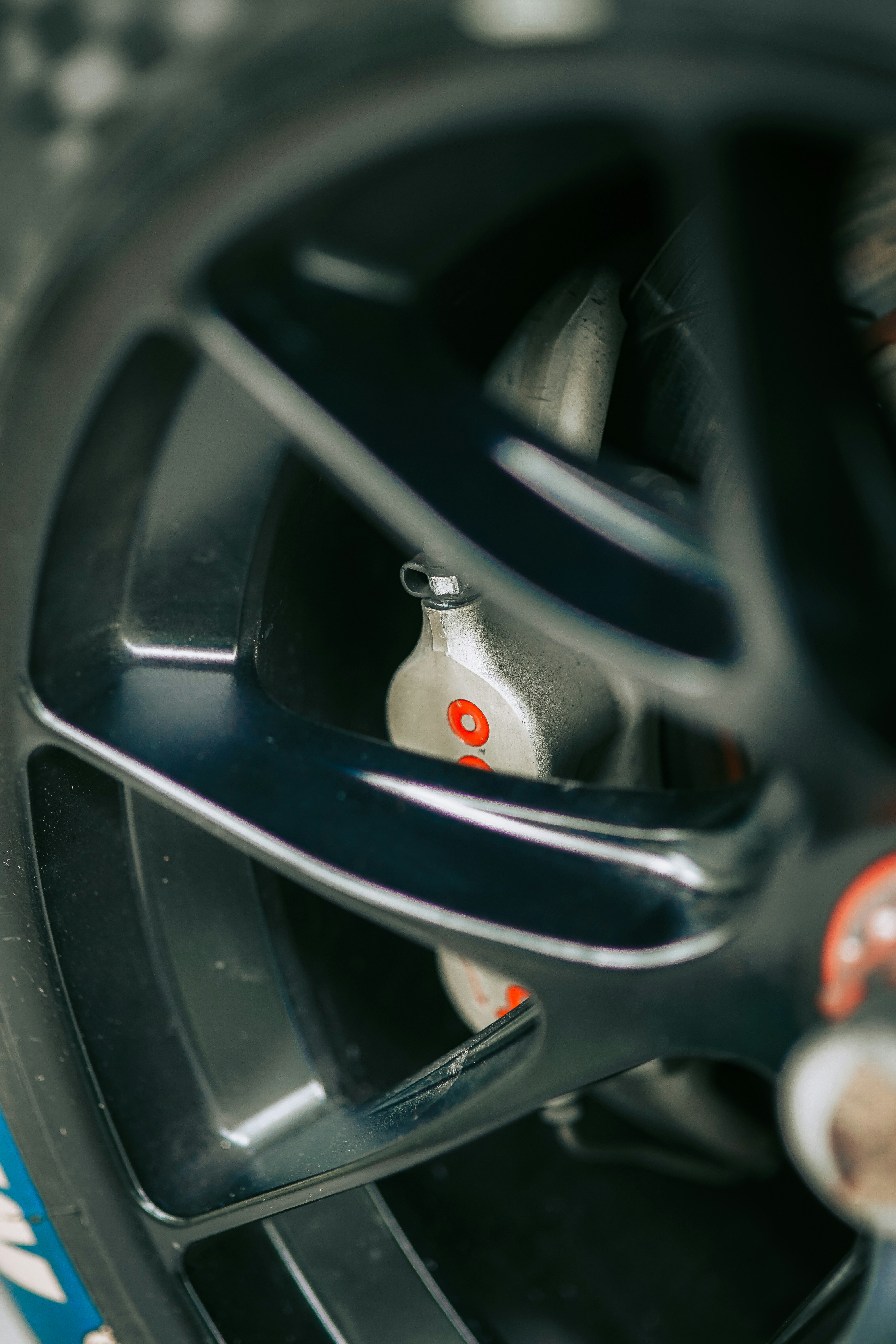 Embedded Caliper and Spoked Wheel: A Close-Up on Car Braking Hardware