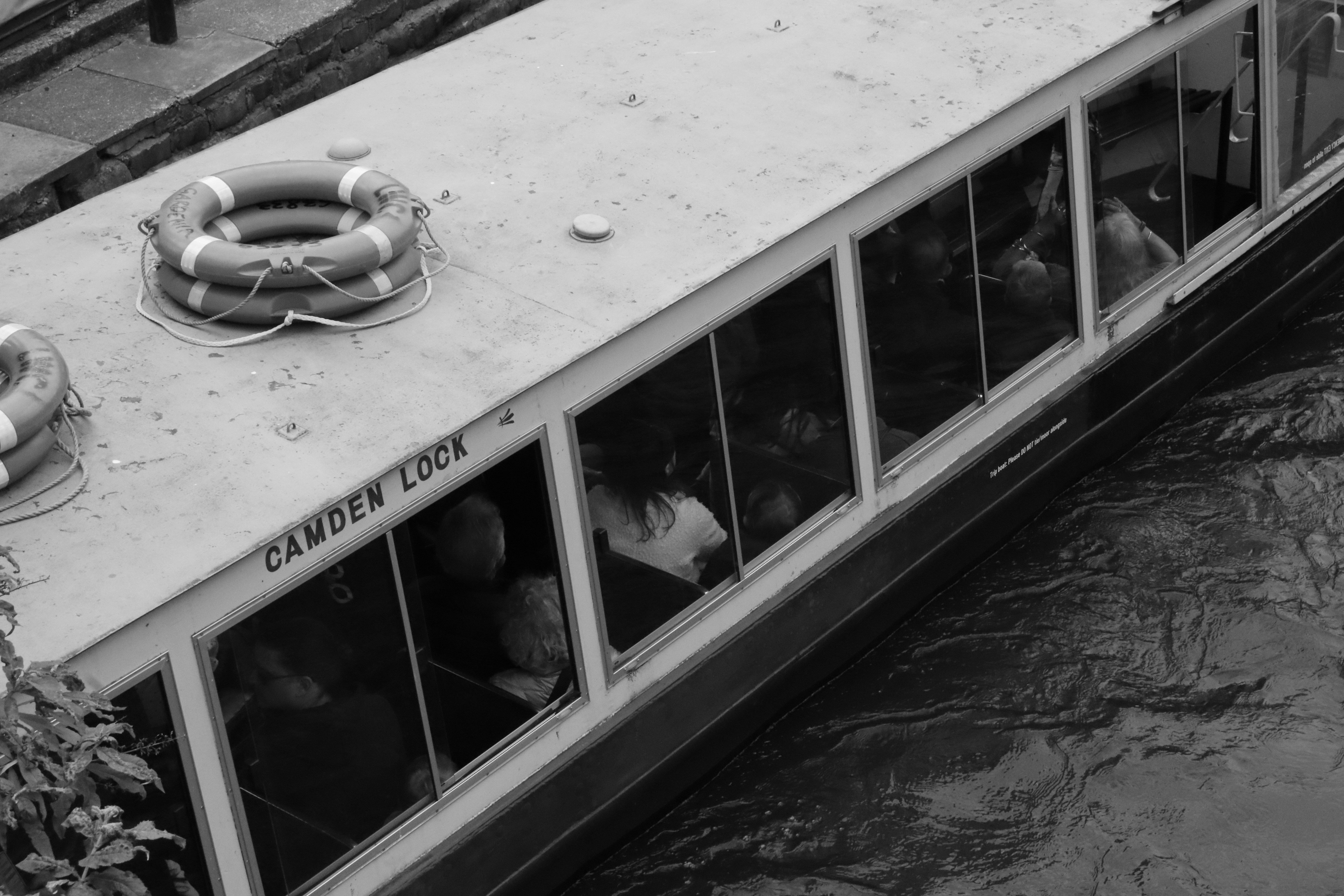 Camden Lock Quiet: Passengers Visible Through Narrowboat Windows